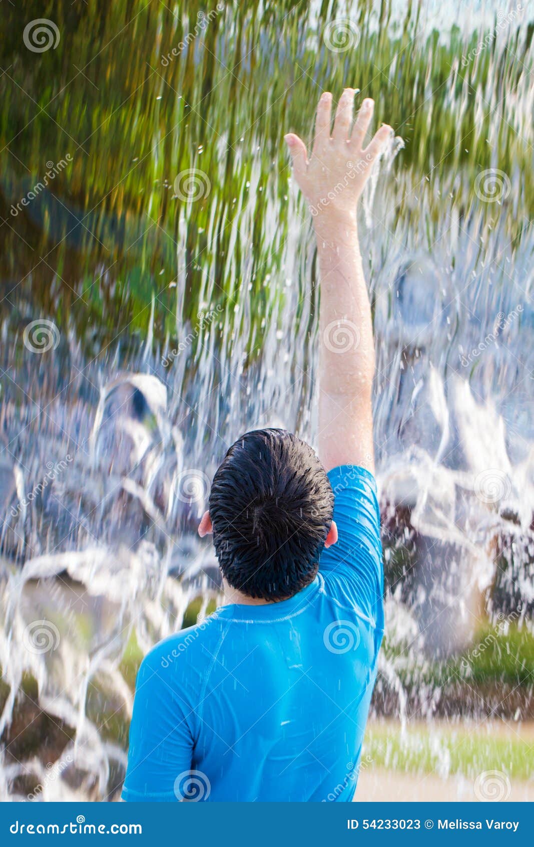 Boy Reaching Up To Feel Water in a Waterfall Stock Image - Image of ...