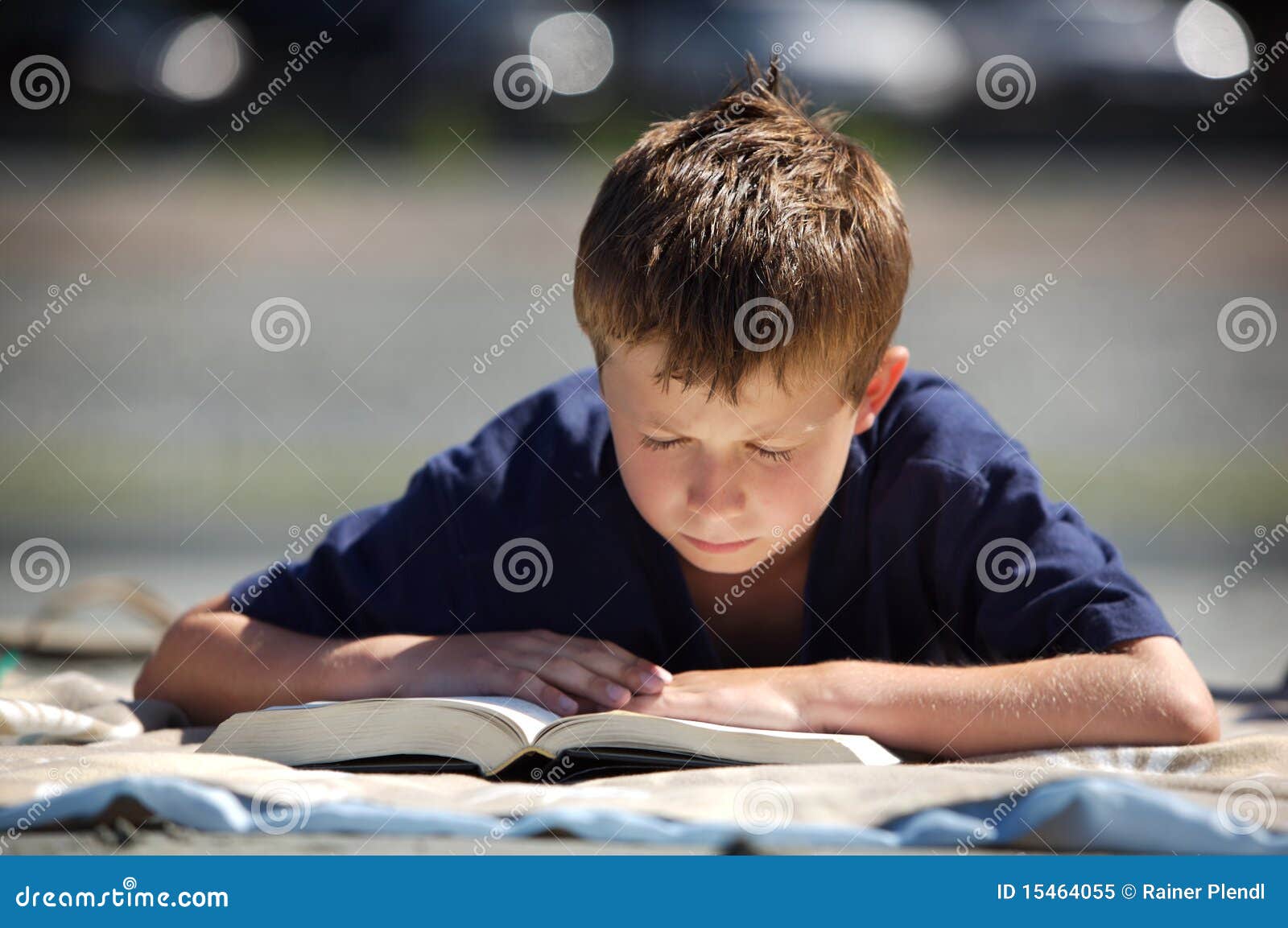 Boy reading stock image. Image of seaside, story, outdoors - 15464055