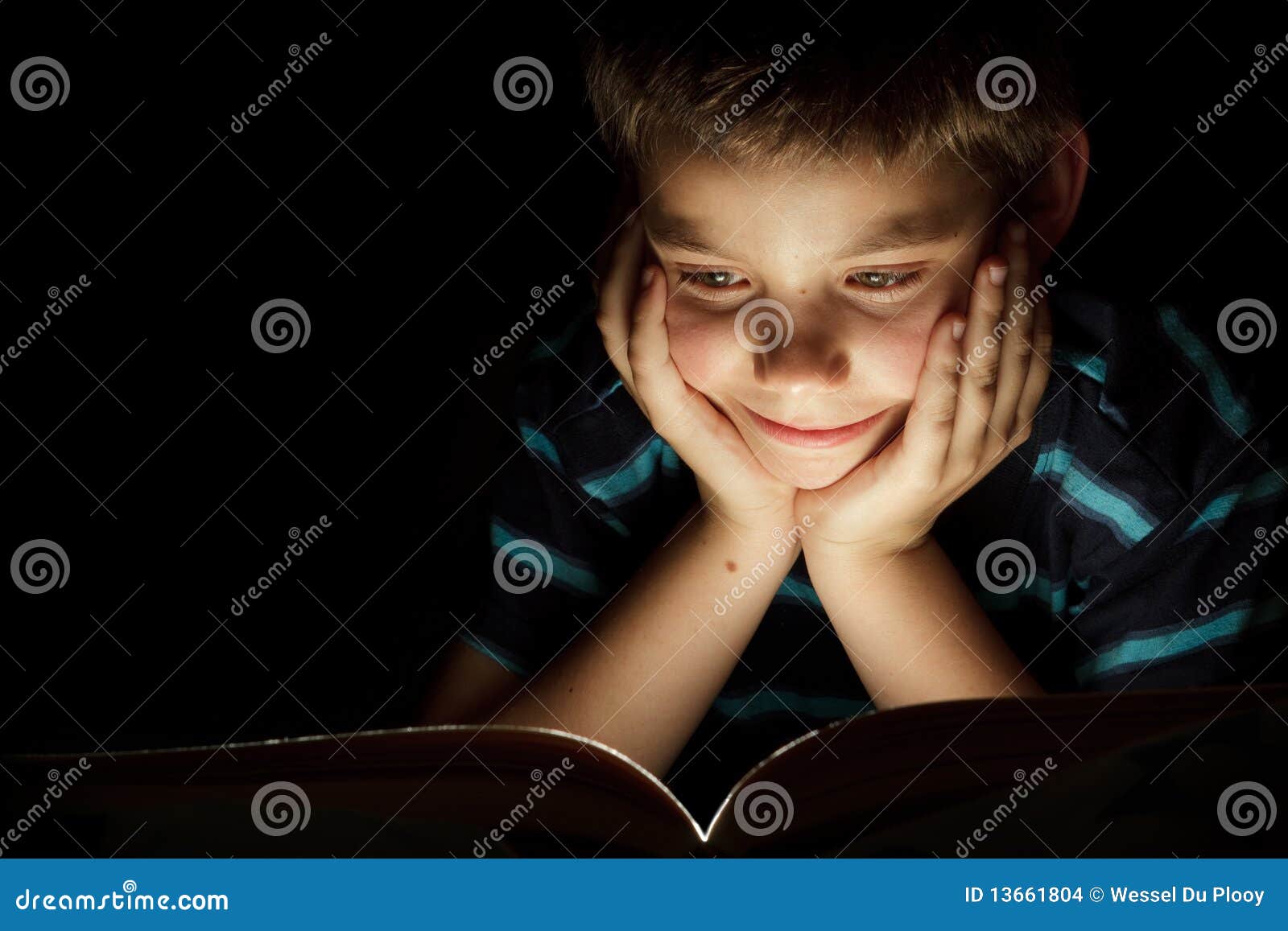 Boy reading bedtime story stock photo. Image of education - 13661804