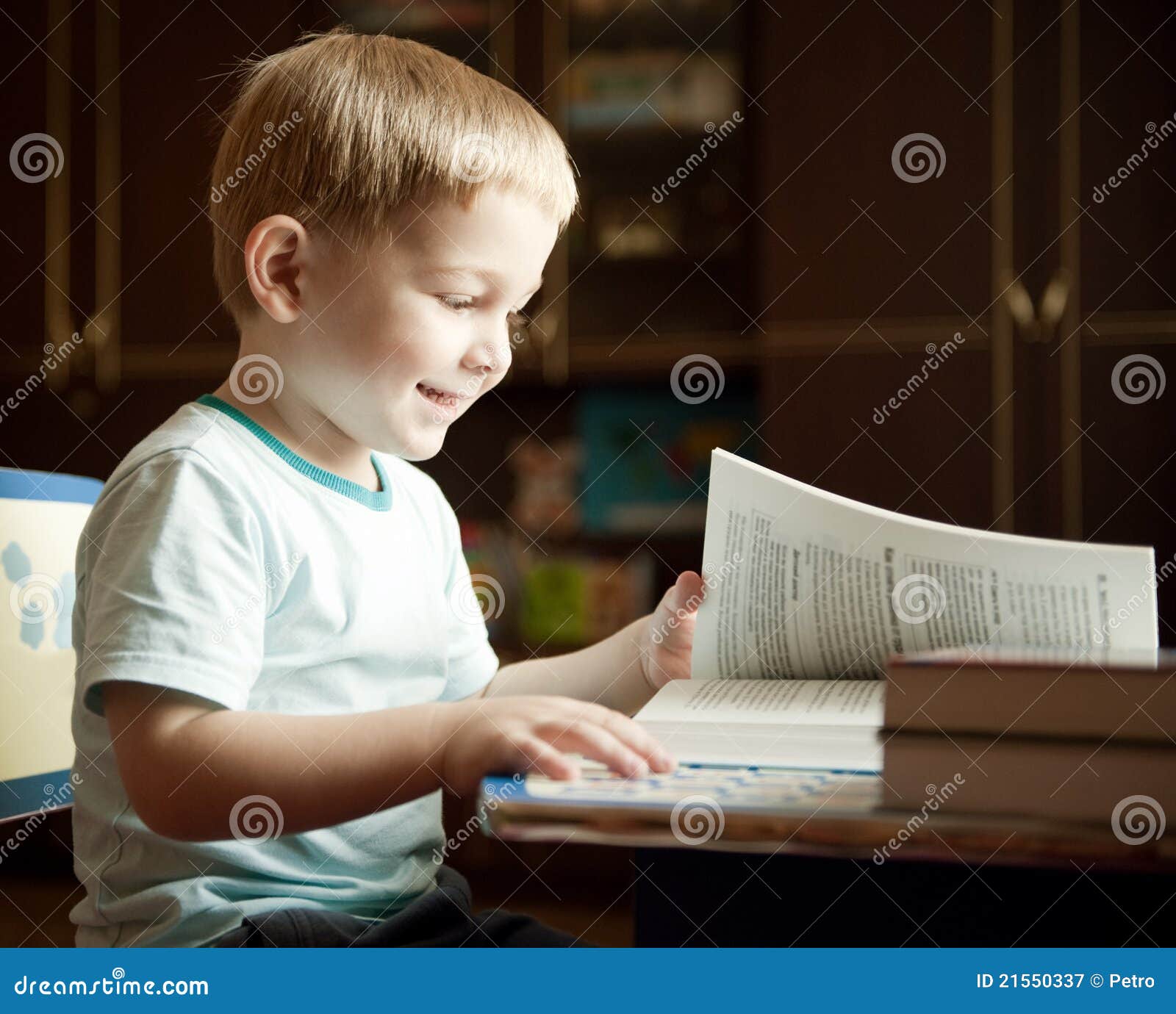 Boy reading book stock image. Image of home, expression - 21550337