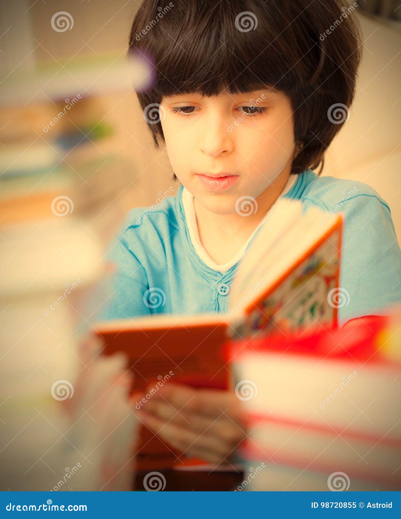 Boy reading a book stock image. Image of happy, latin - 98720855