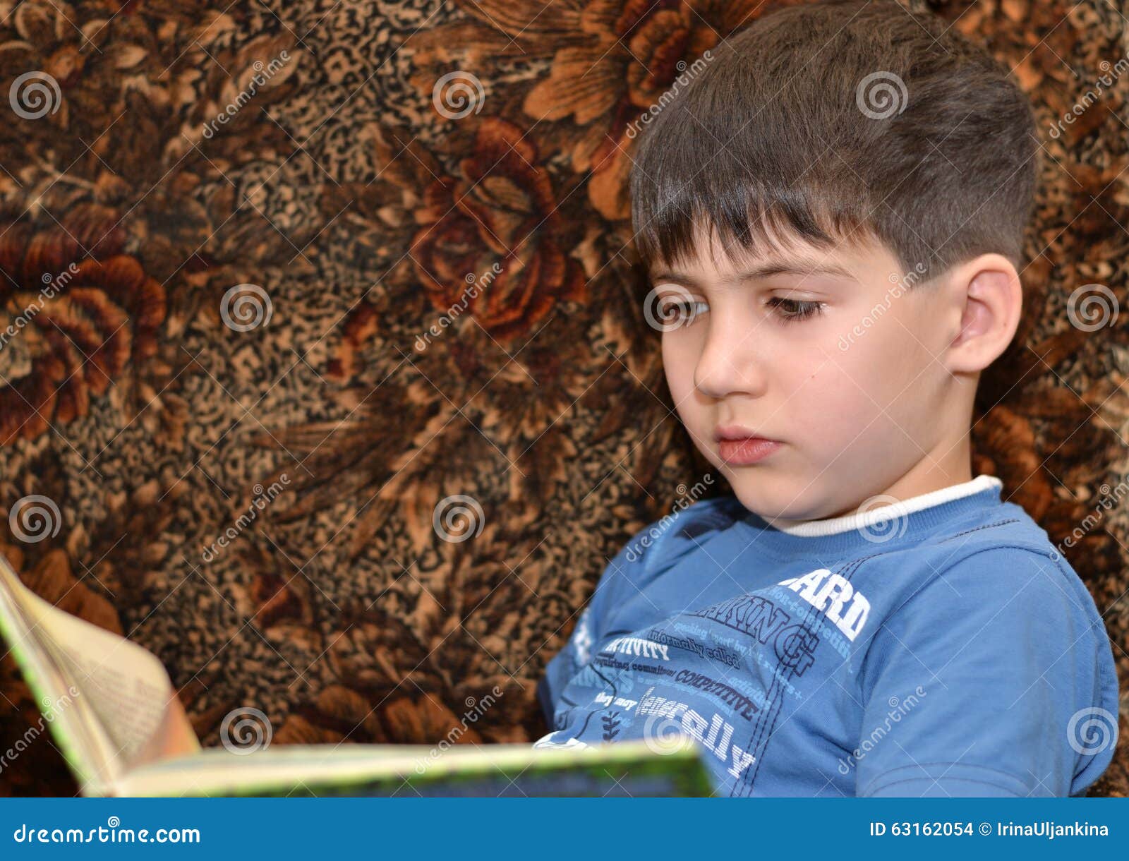 Boy is reading a book. stock photo. Image of child, education - 63162054