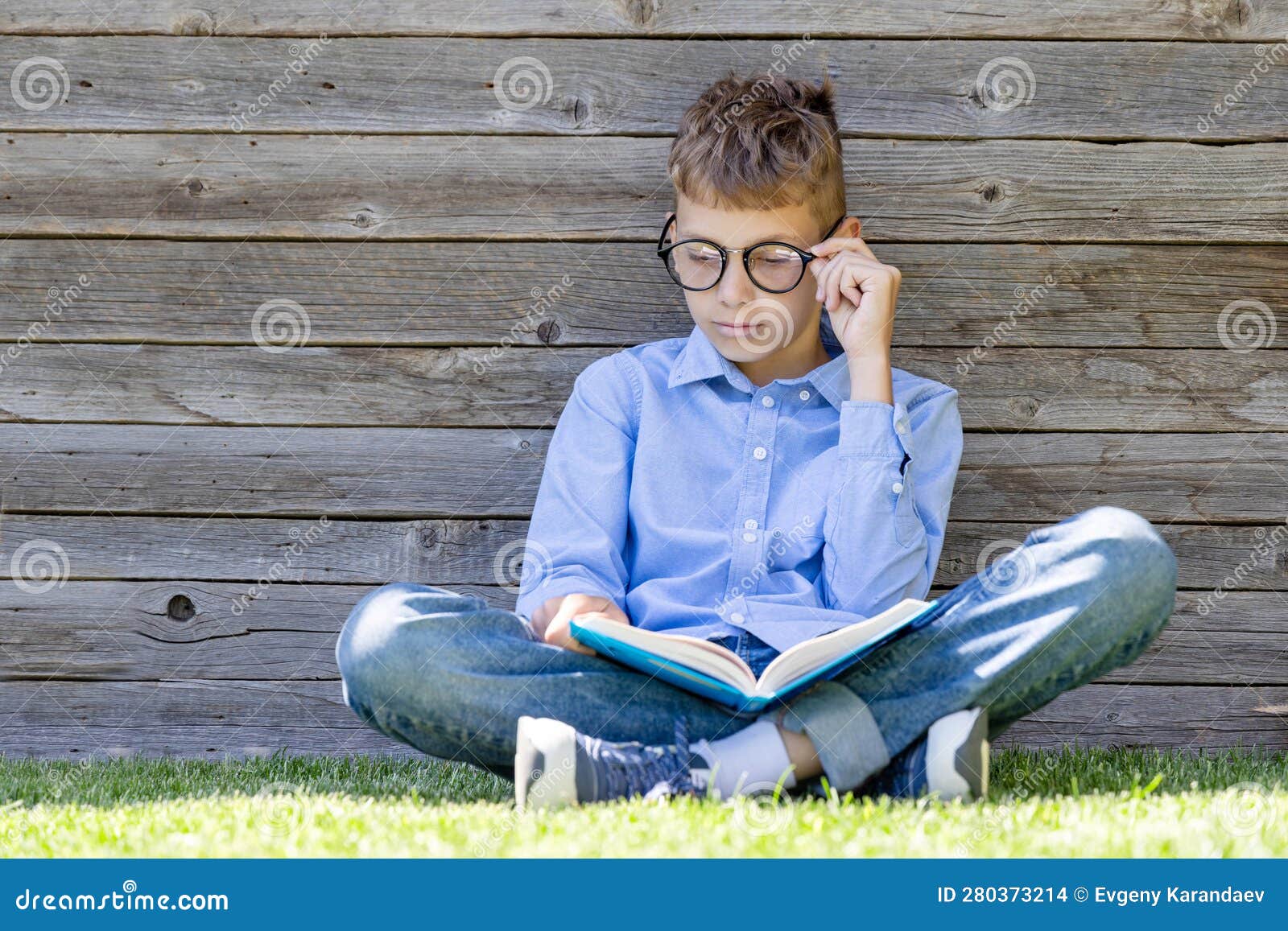 A Boy Reading a Book on a Grass Stock Photo - Image of literature ...