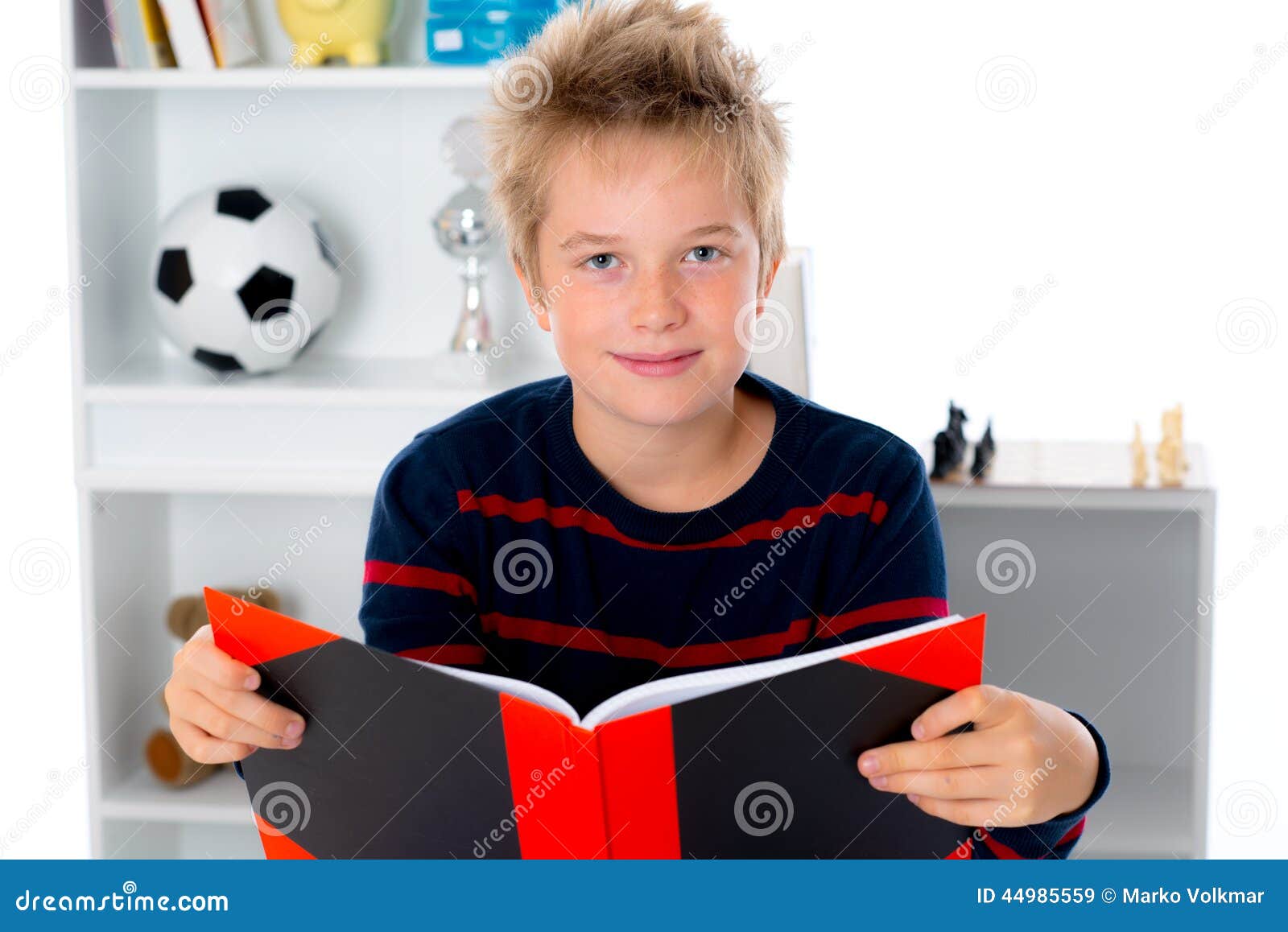 Boy is reading a book stock image. Image of smile, learn - 44985559