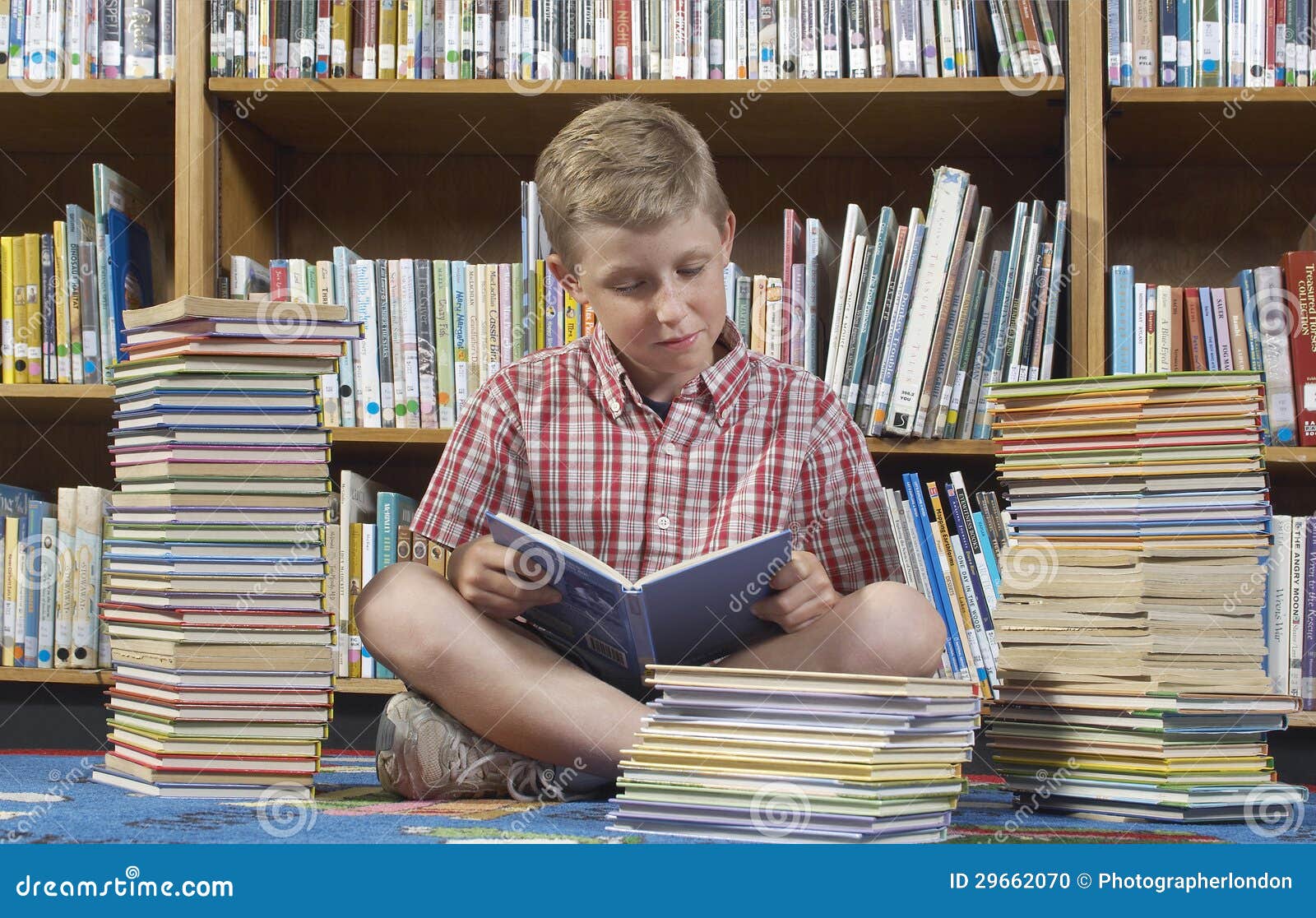 Boy Reading Book In Library Stock Photo - Image: 29662070 Boy Reading Book In Library Stock Photo - Image: 29662070