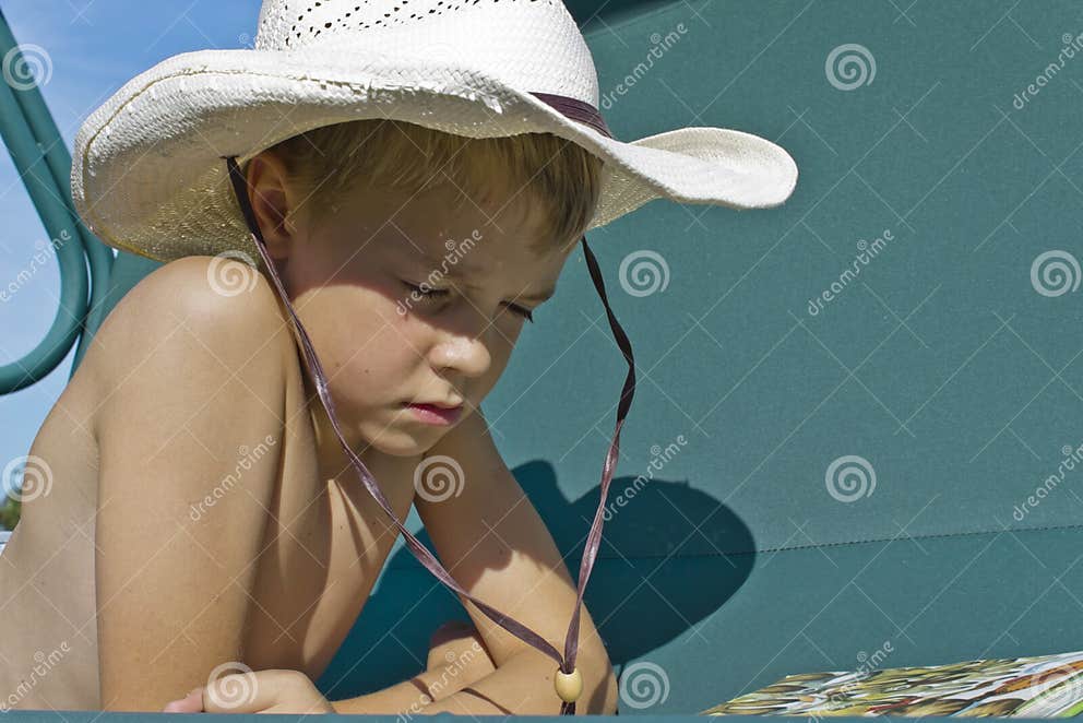 Boy reading a book stock photo. Image of considerate - 32315858