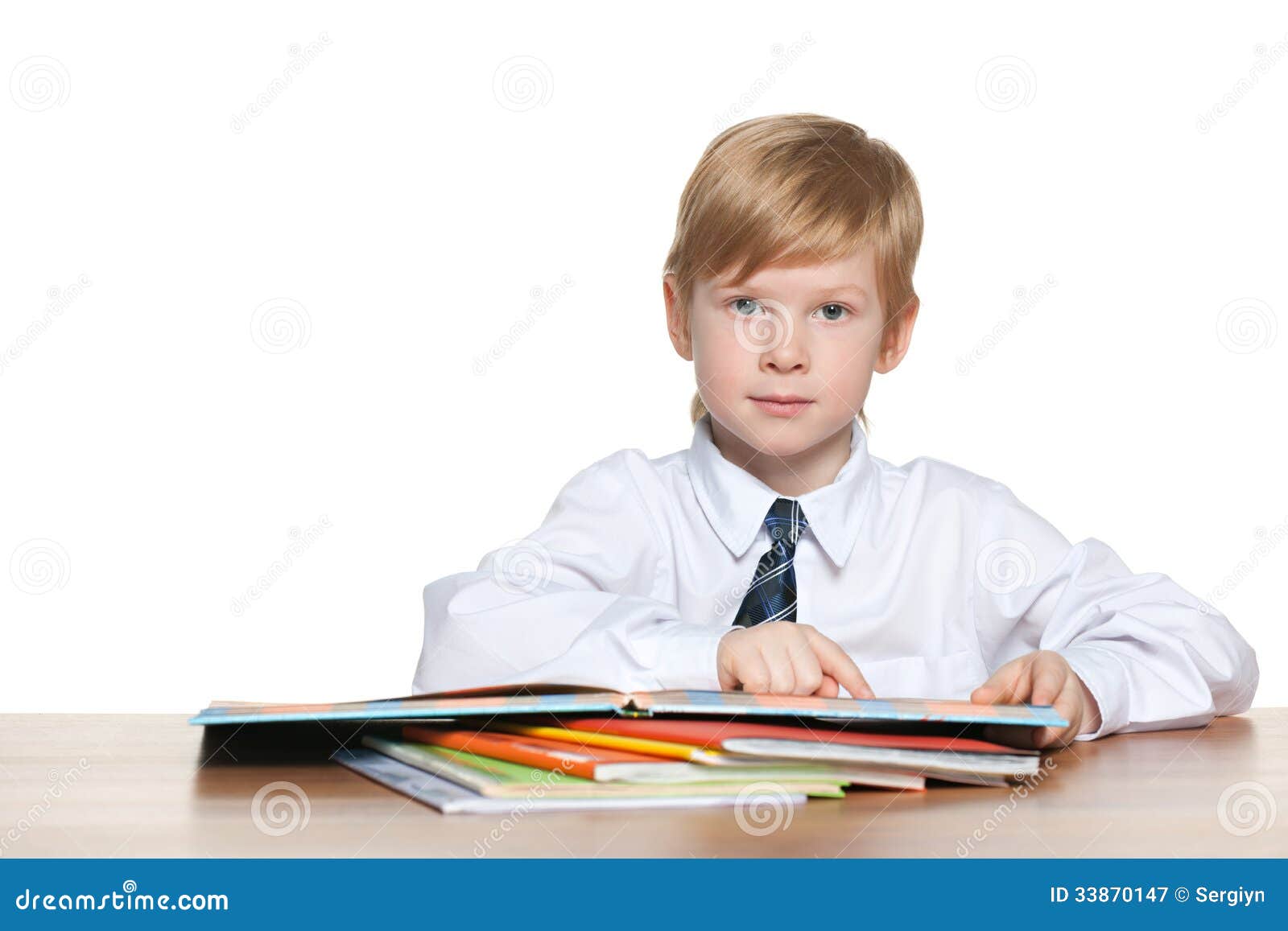 Boy is reading at the desk stock image. Image of class - 33870147