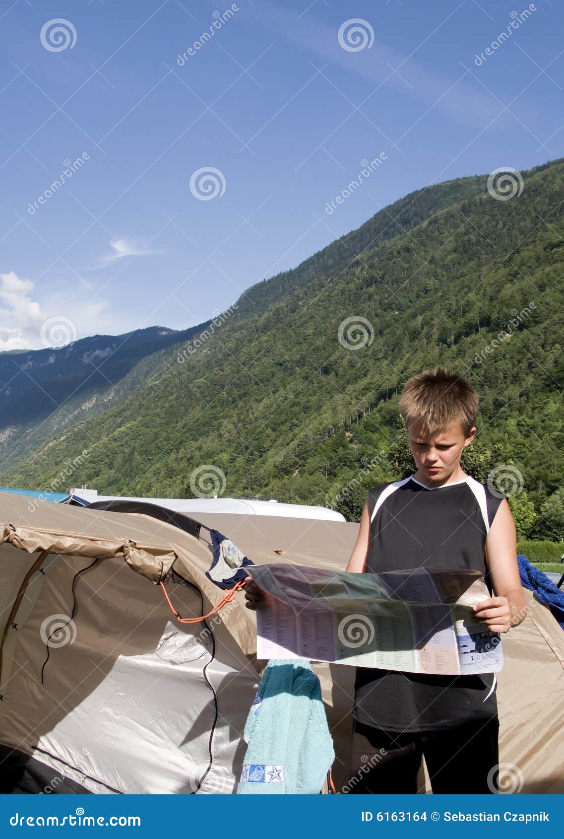 Boy reading map stock photo. Image of trekking, consulting - 6163164