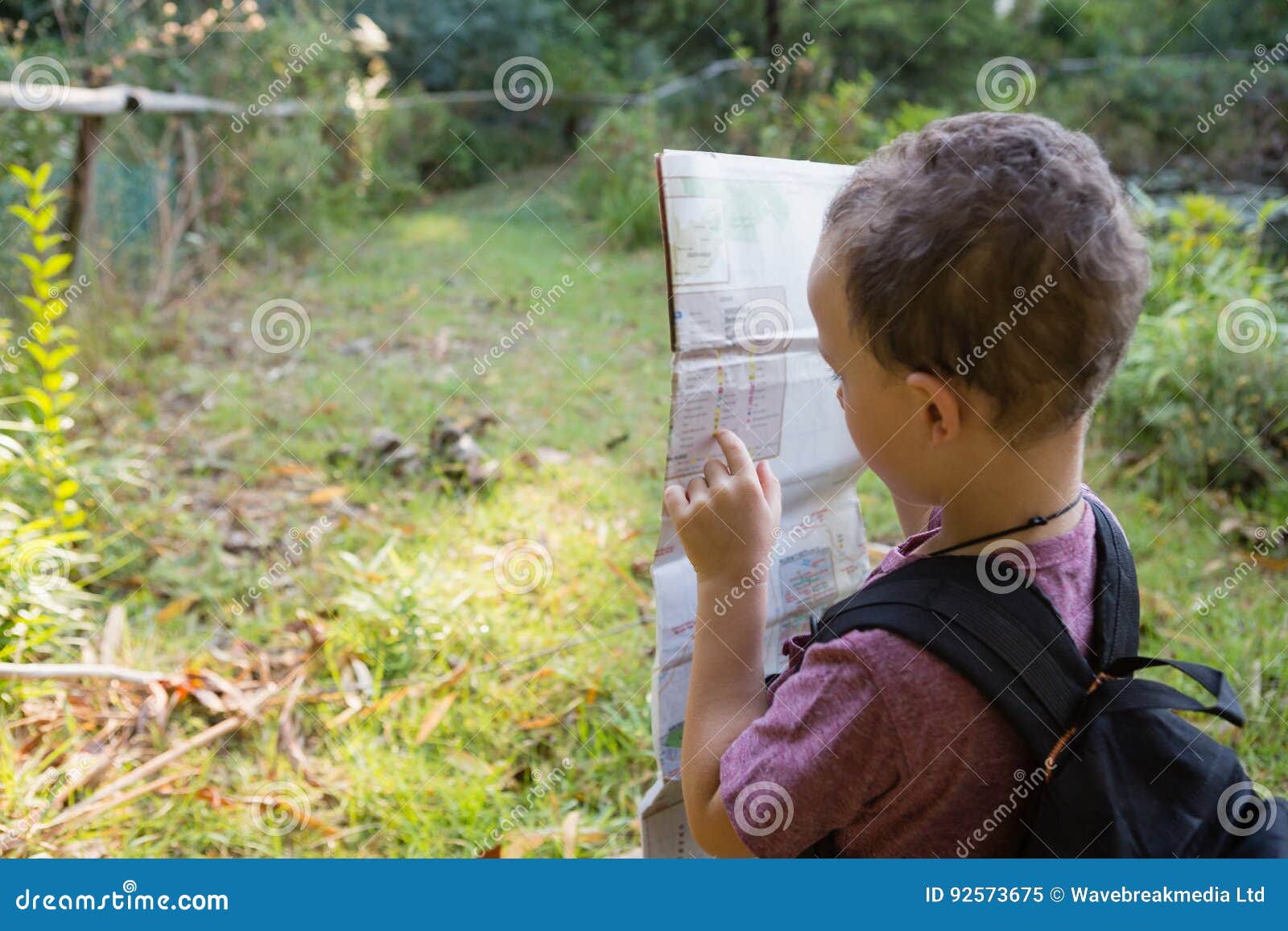 Boy Reading the Map in the Forest Stock Image - Image of cute, location ...