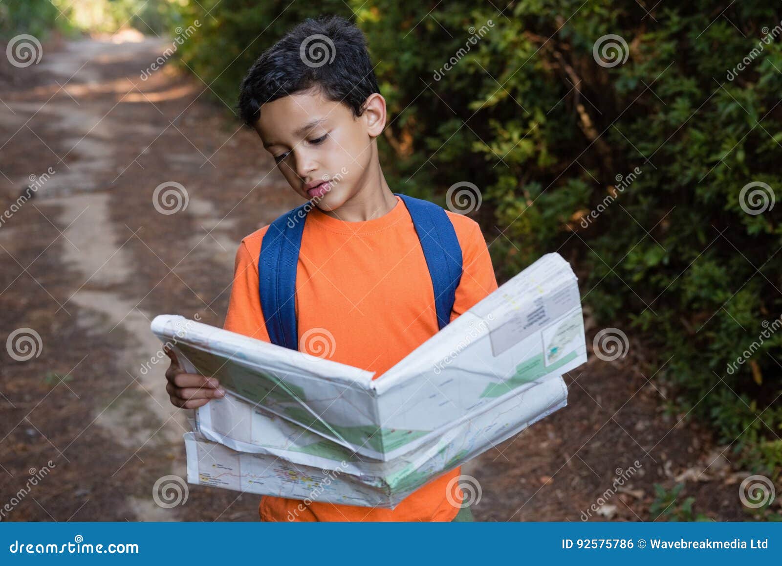 Boy Reading the Map while Standing on the Path Stock Photo - Image of ...