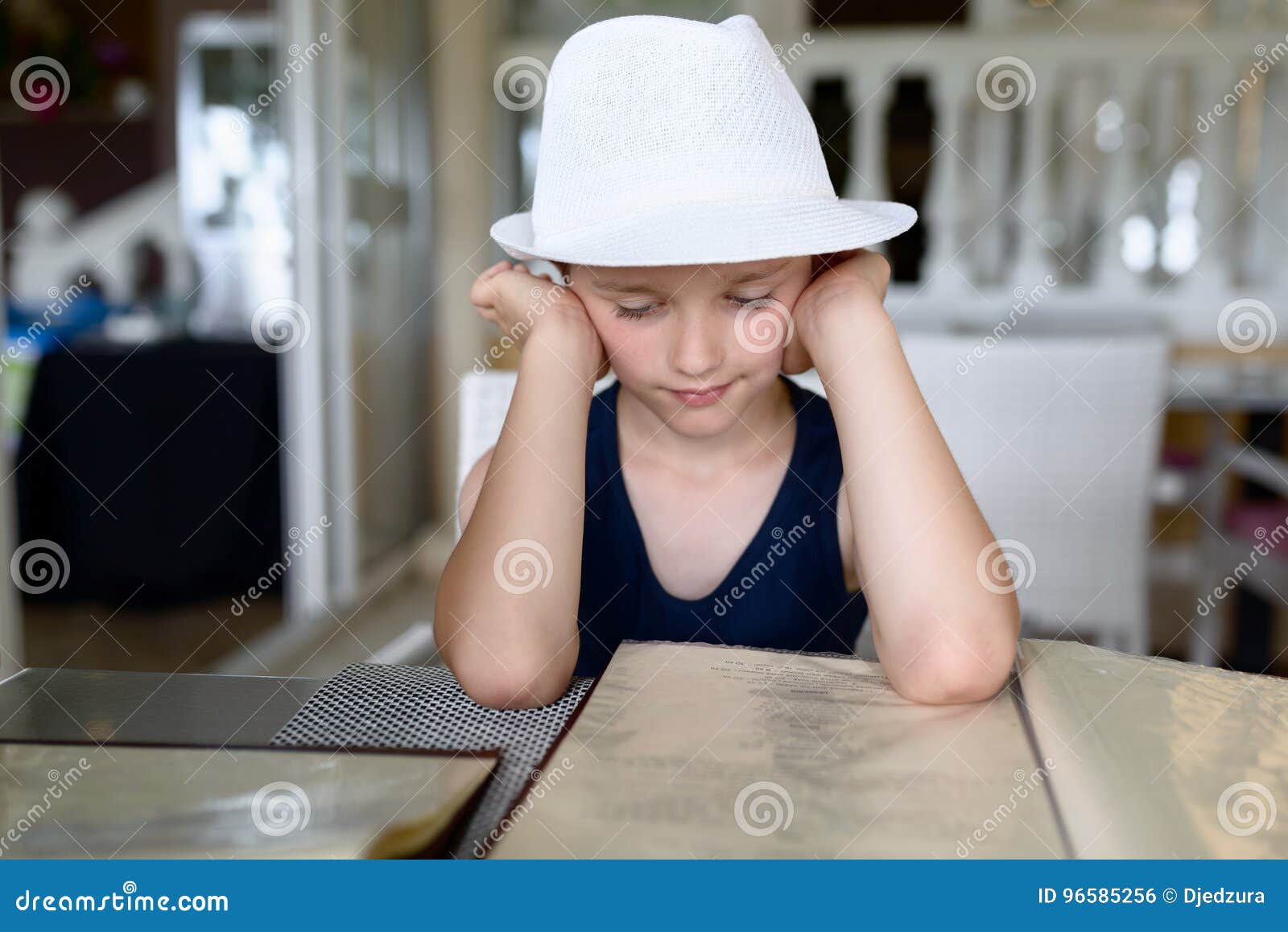 Boy Reading Menu in Restaurant or Cafe. Stock Photo - Image of food ...