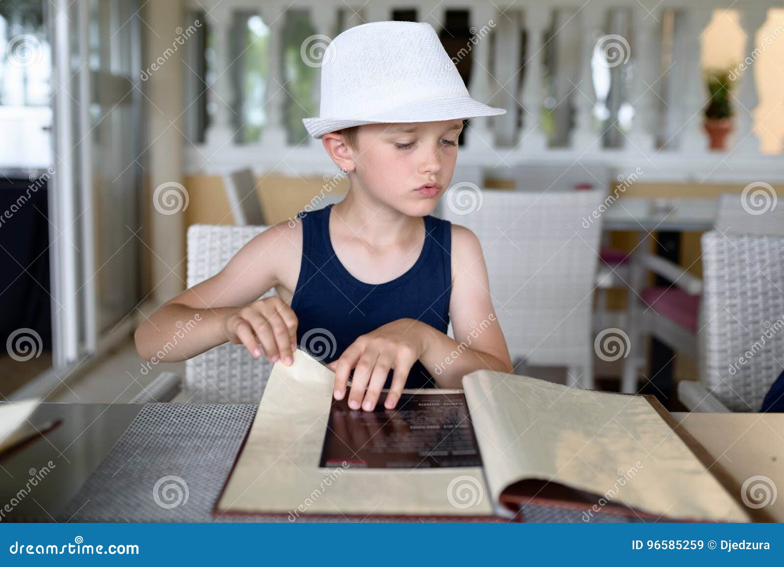 Boy Reading Menu in Restaurant or Cafe. Stock Image - Image of ...