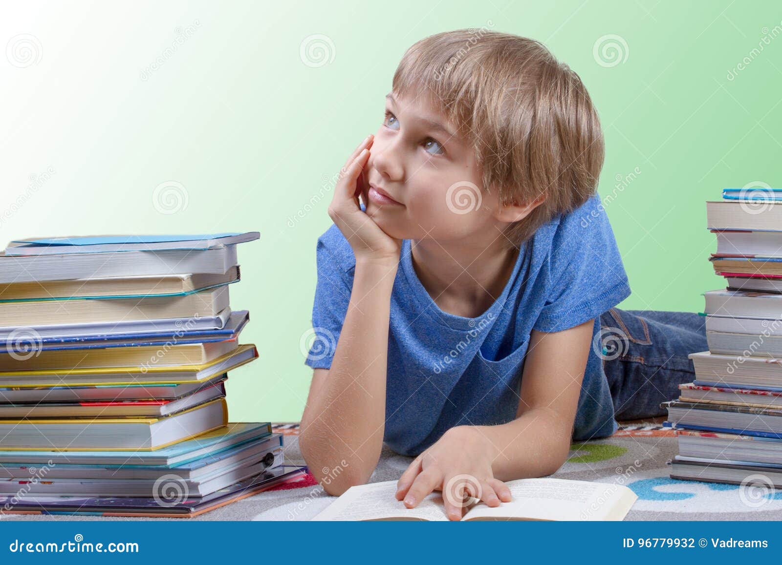 Boy Reading between the Stack of Books. Stock Photo - Image of ...
