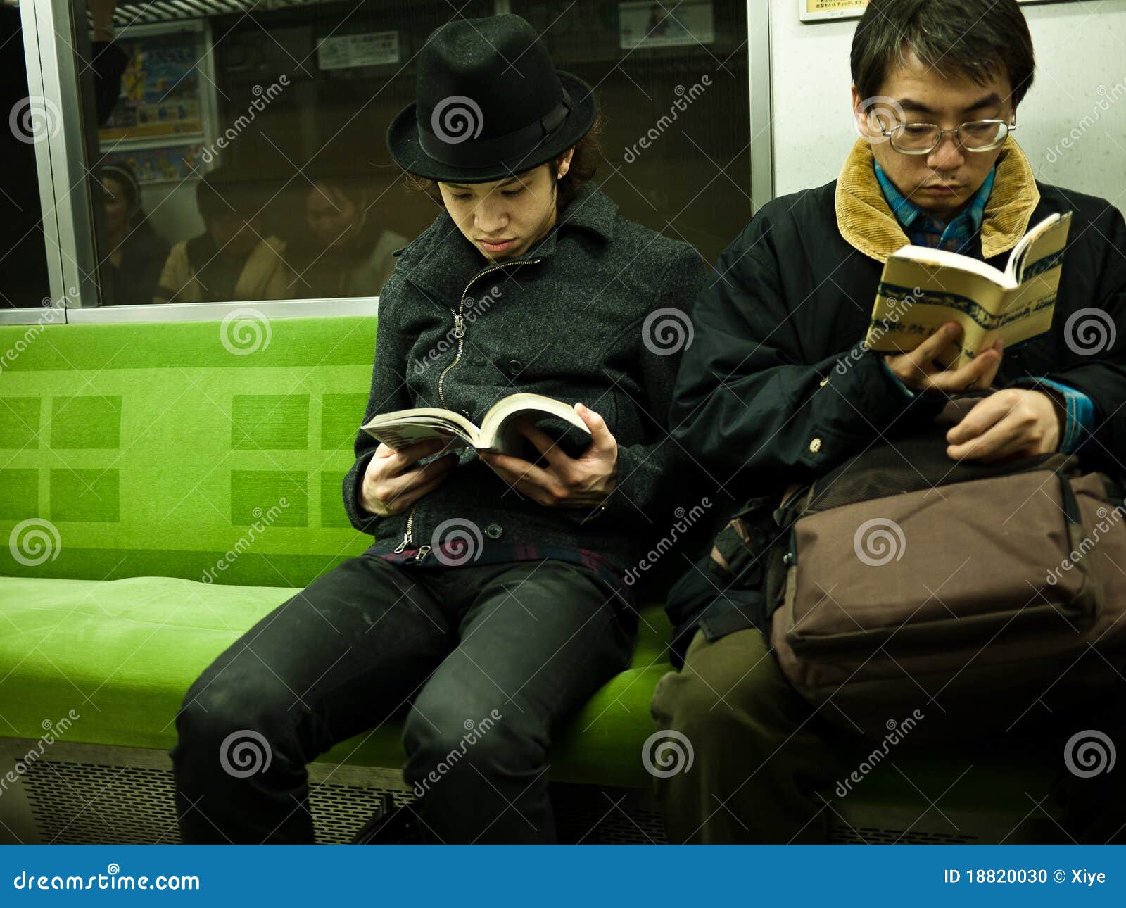 Boy reading in subway editorial image. Image of habit - 18820030