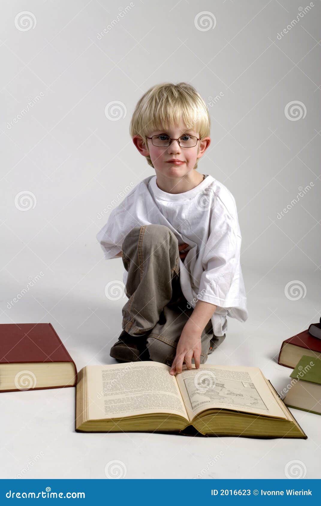 Boy is reading thick books stock image. Image of small - 2016623
