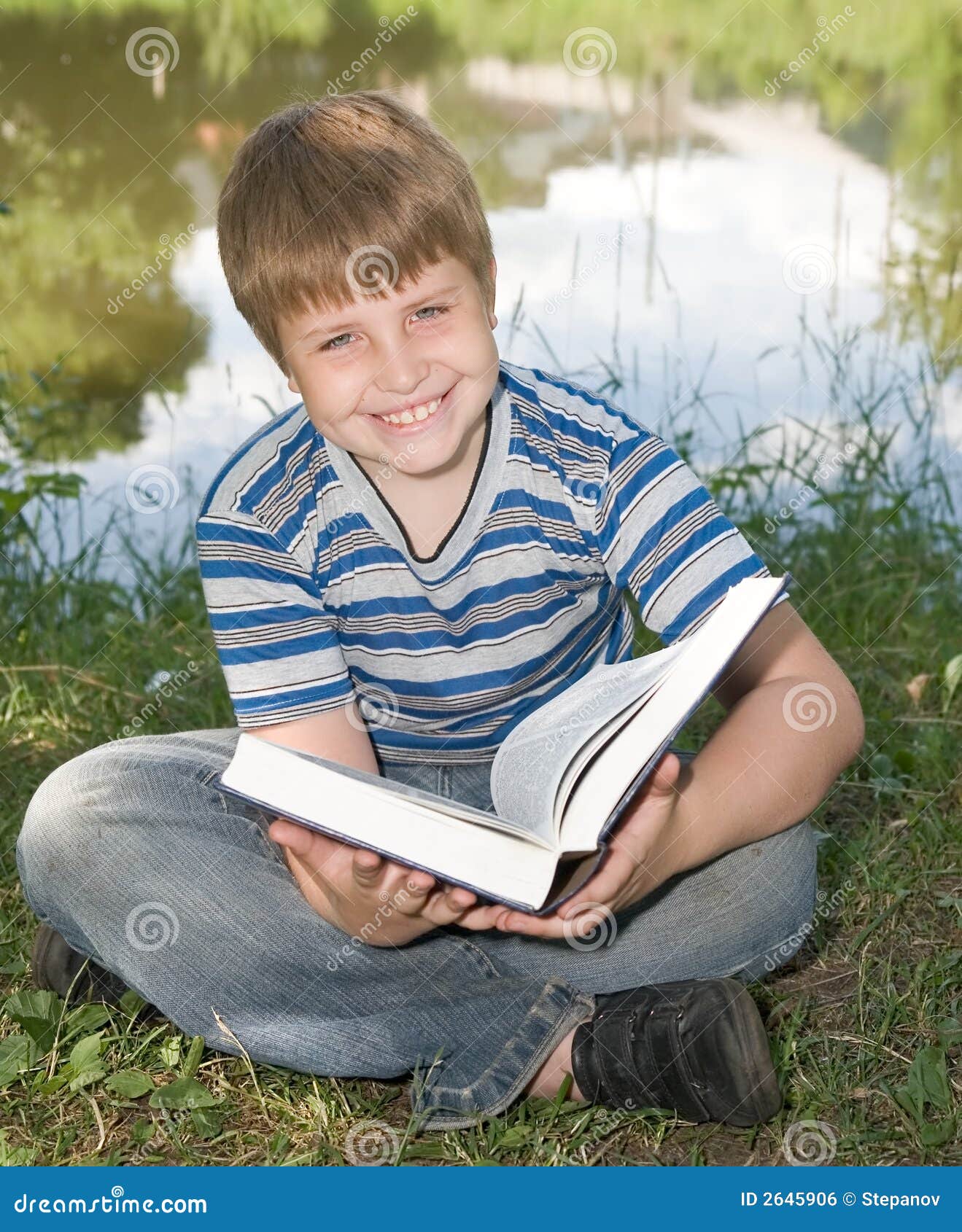 Boy reads a big book stock photo. Image of peaceful, person - 2645906