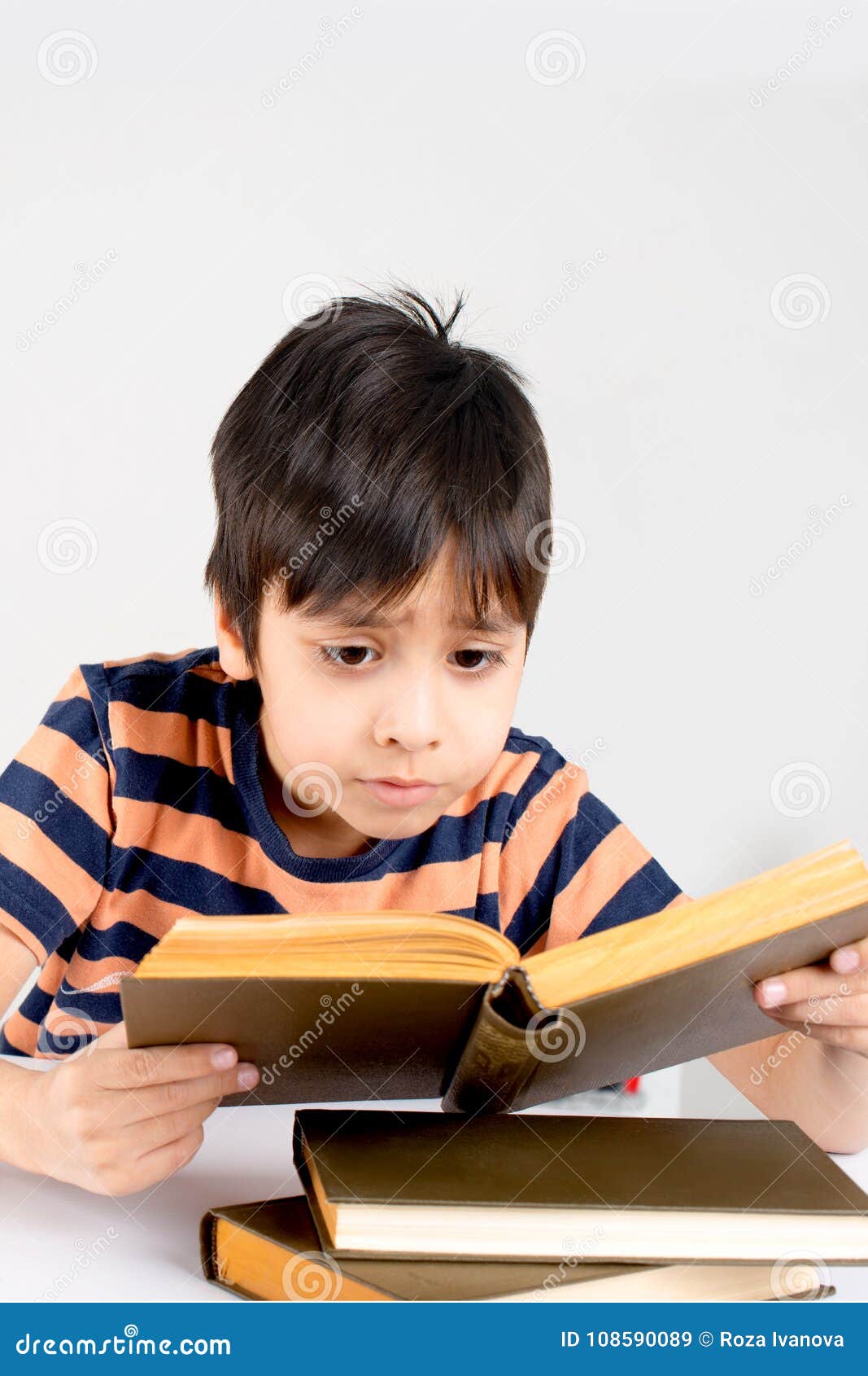 The boy reads the book. stock image. Image of child - 108590089