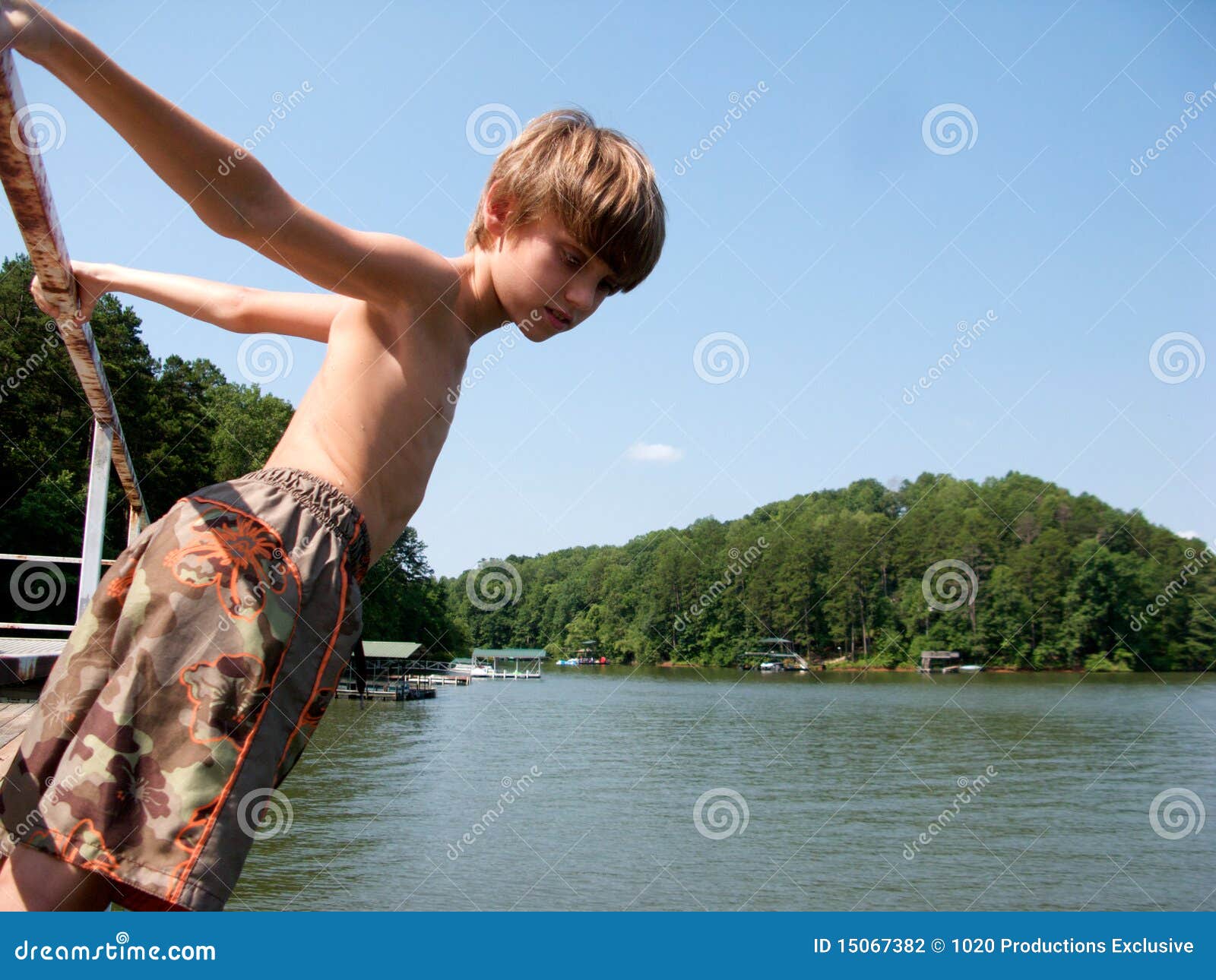 Boy ready to dive in lake stock photo. Image of leans - 15067382