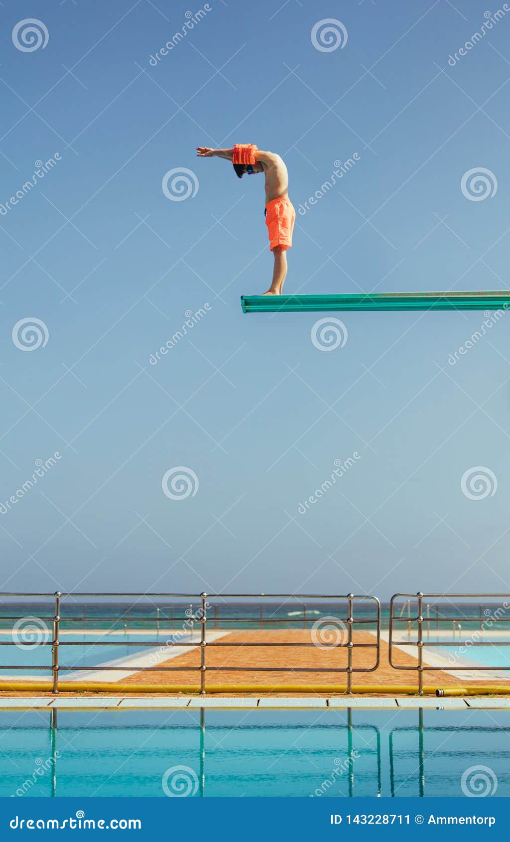 Boy Ready To Dive into Pool Stock Image - Image of pool, people: 143228711