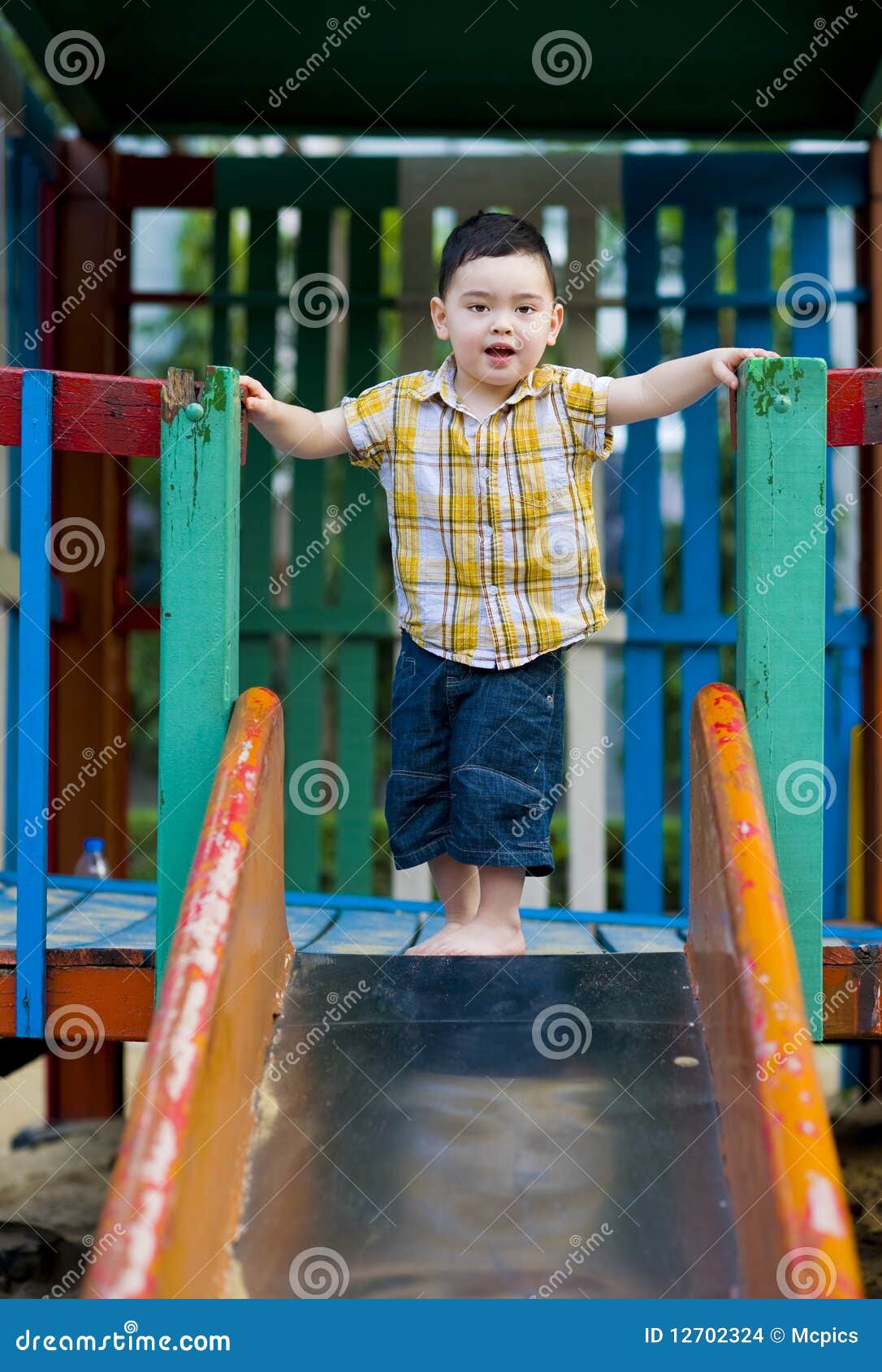 Boy ready to slide slide stock photo. Image of park, carefree - 12702324