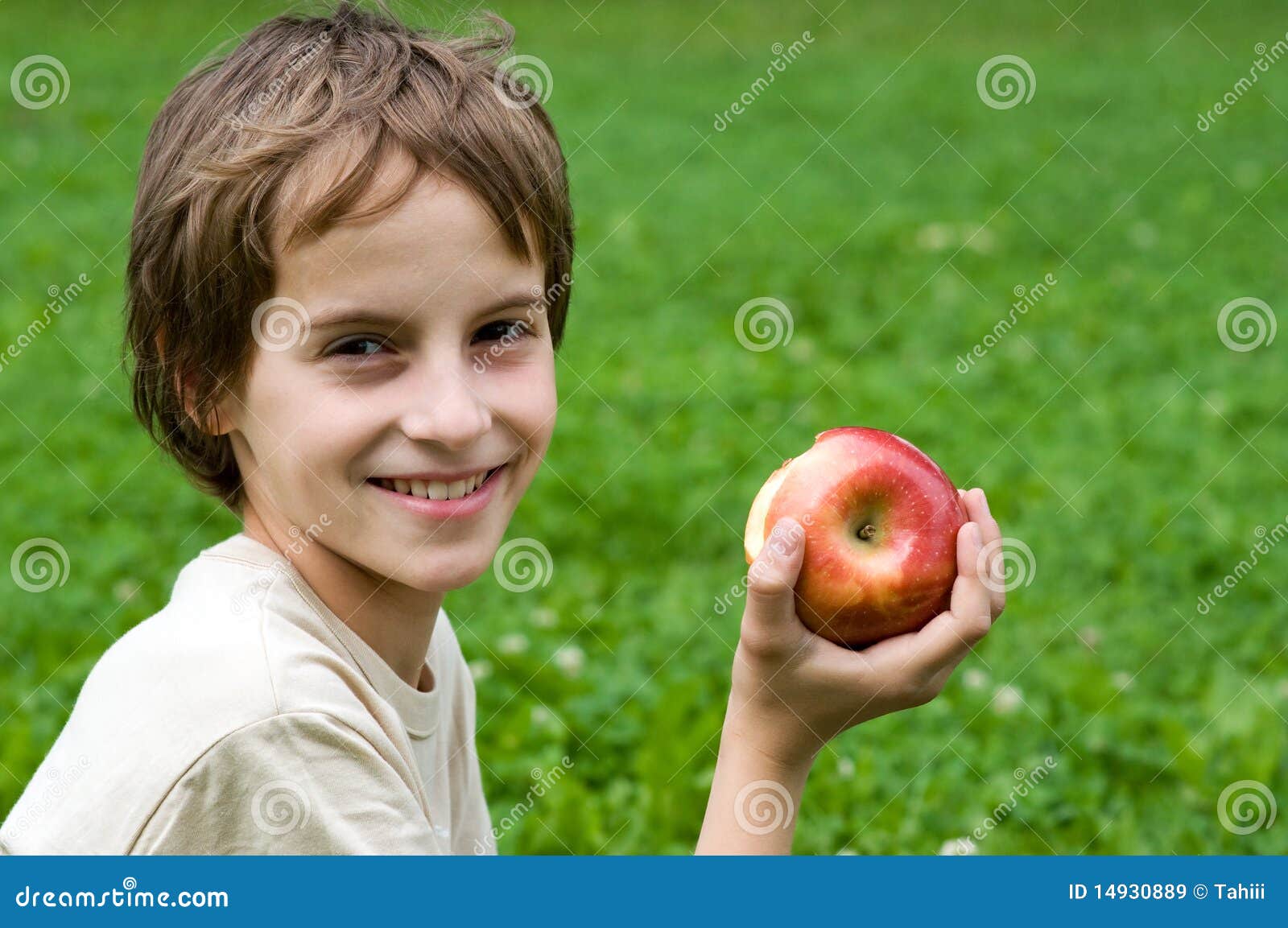 Boy with red apple stock image. Image of fruit, expression - 14930889