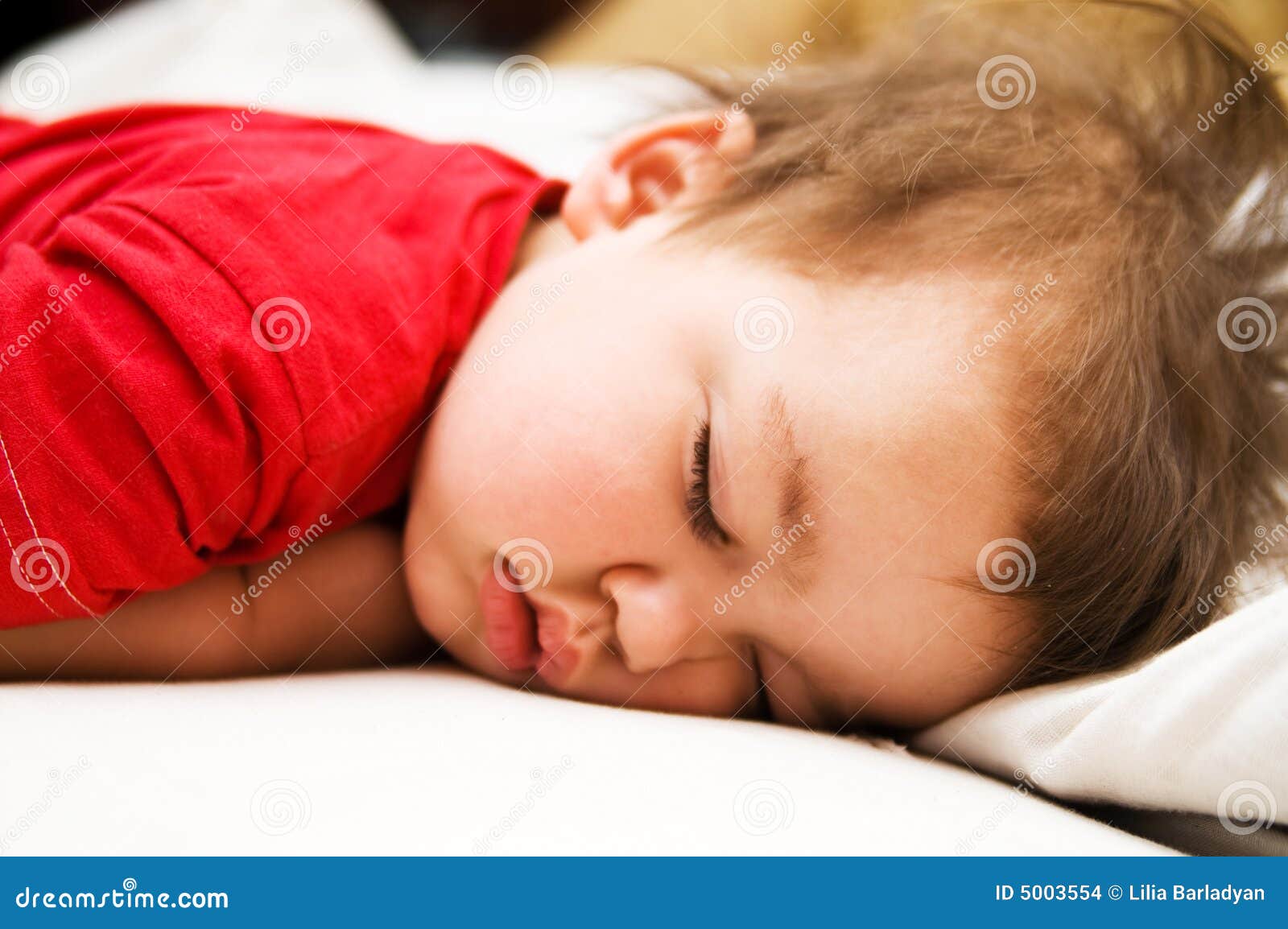 Boy in Red Dress Sleeping on Bed Stock Photo - Image of morning, boys ...