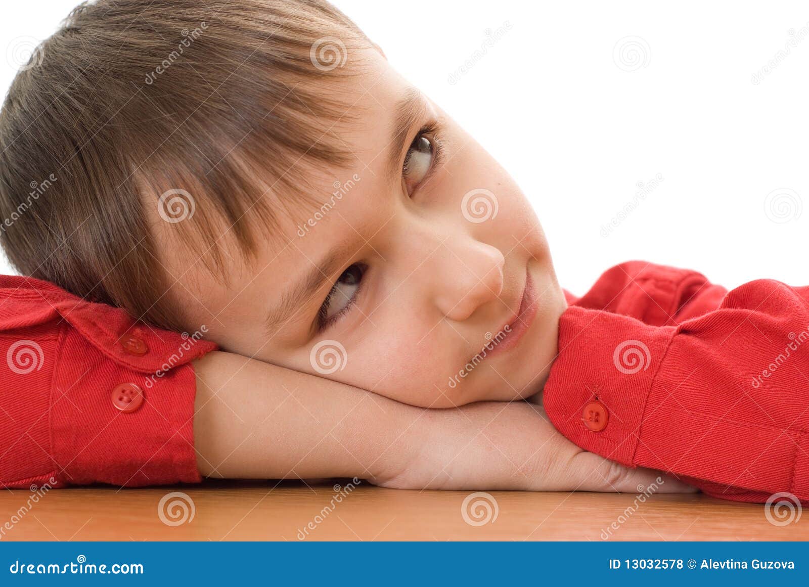 Boy in a Red Shirt at the Table and Dreaming Stock Photo - Image of ...