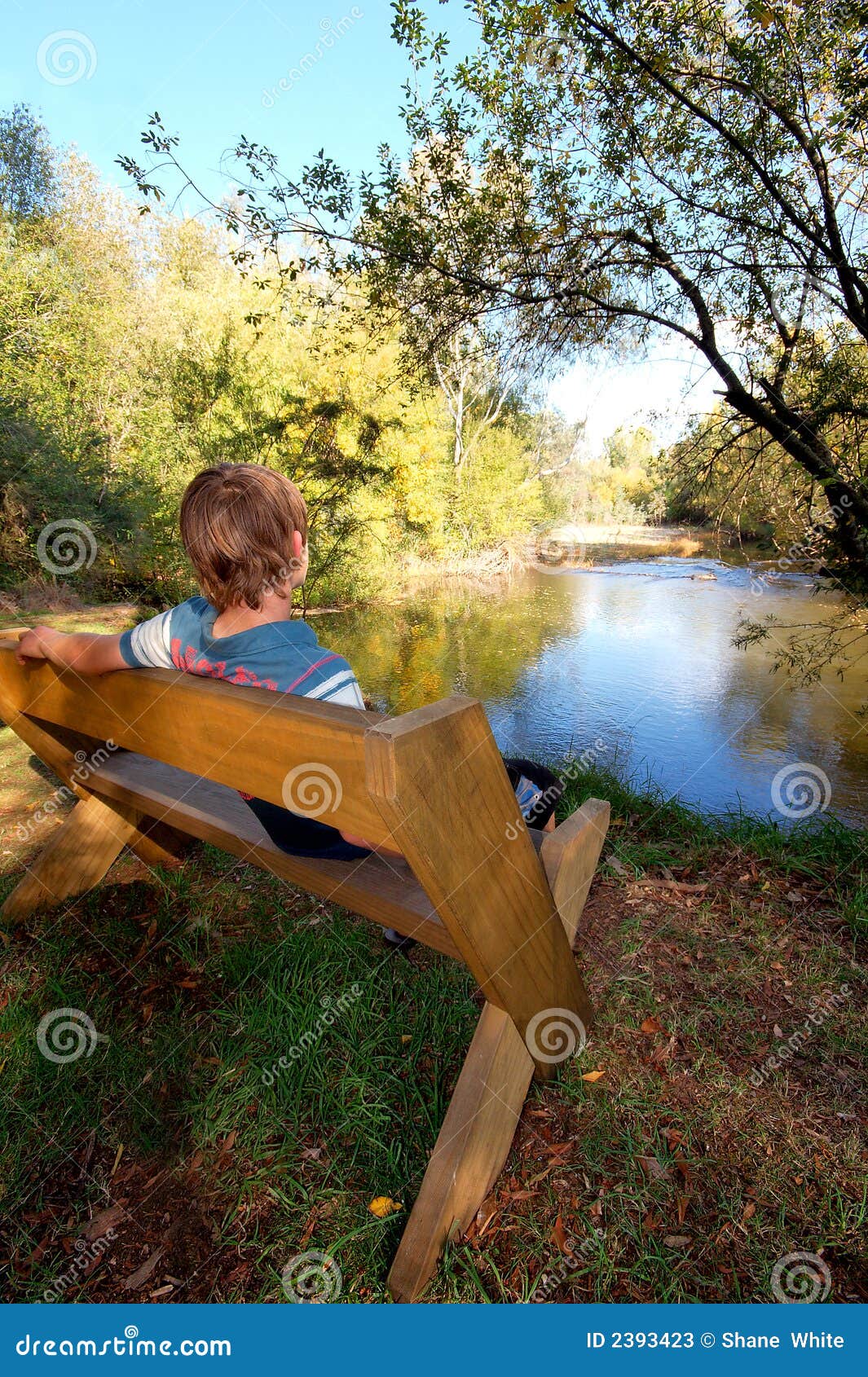 Boy relaxing stock image. Image of australia, chair, river - 2393423