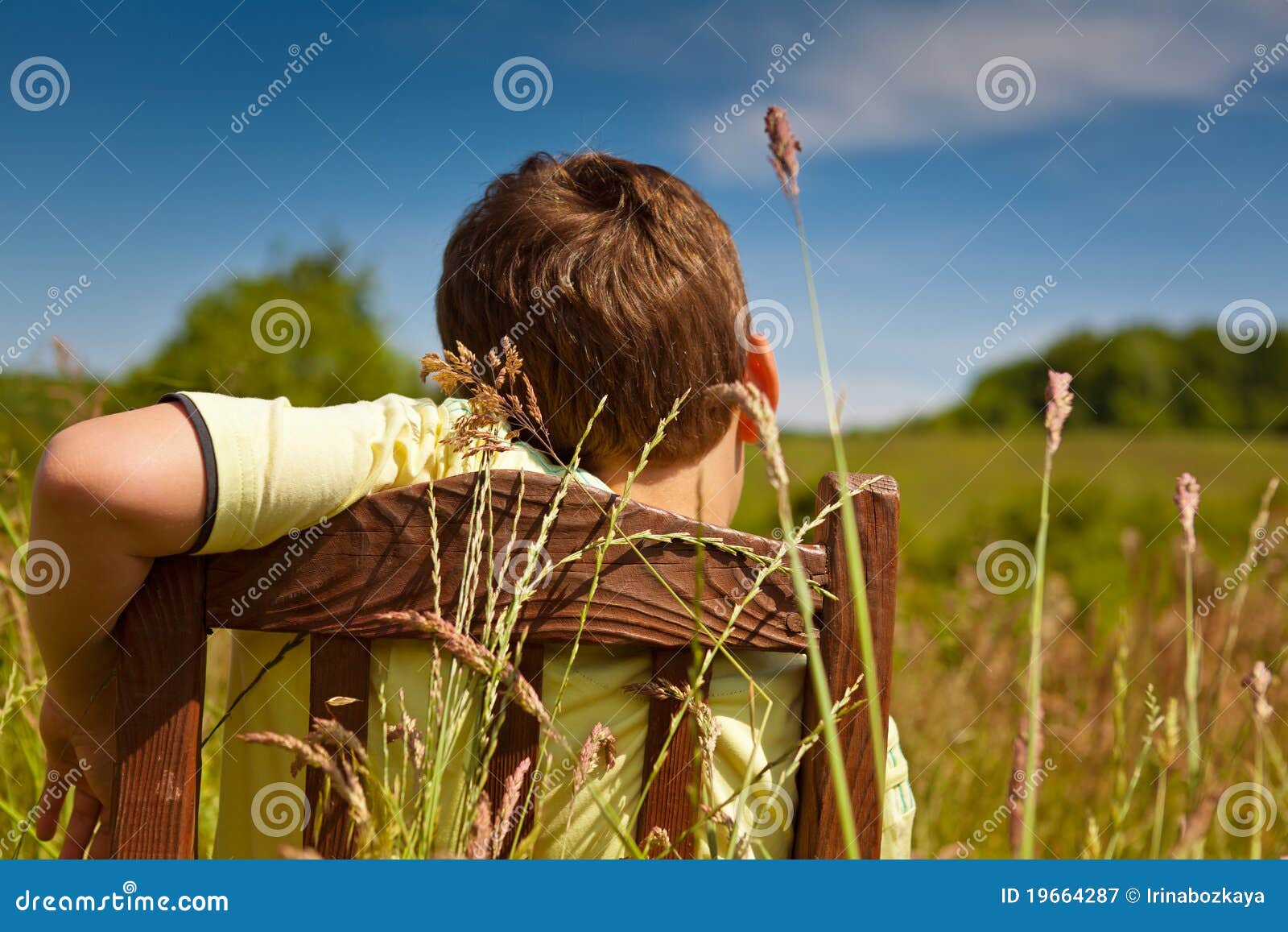 Boy relaxing on a meadow stock image. Image of landscape - 19664287