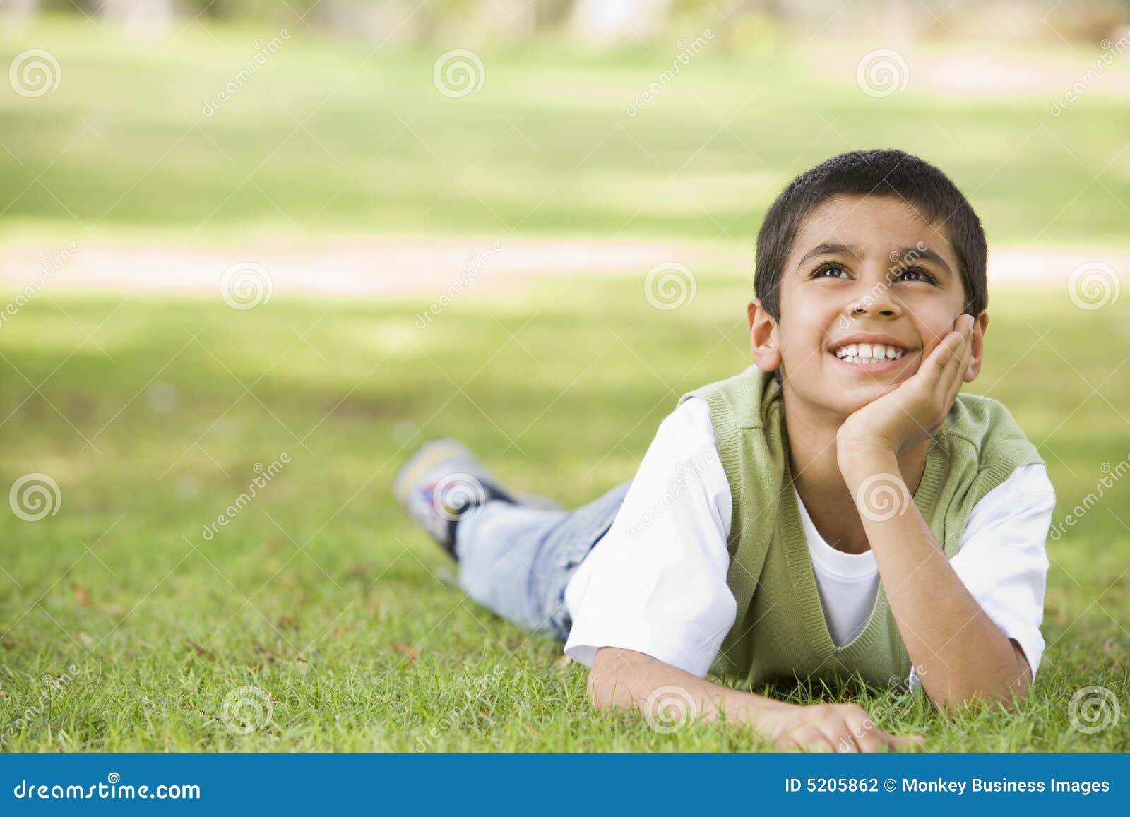 Boy relaxing in park stock photo. Image of relaxing, relaxed - 5205862
