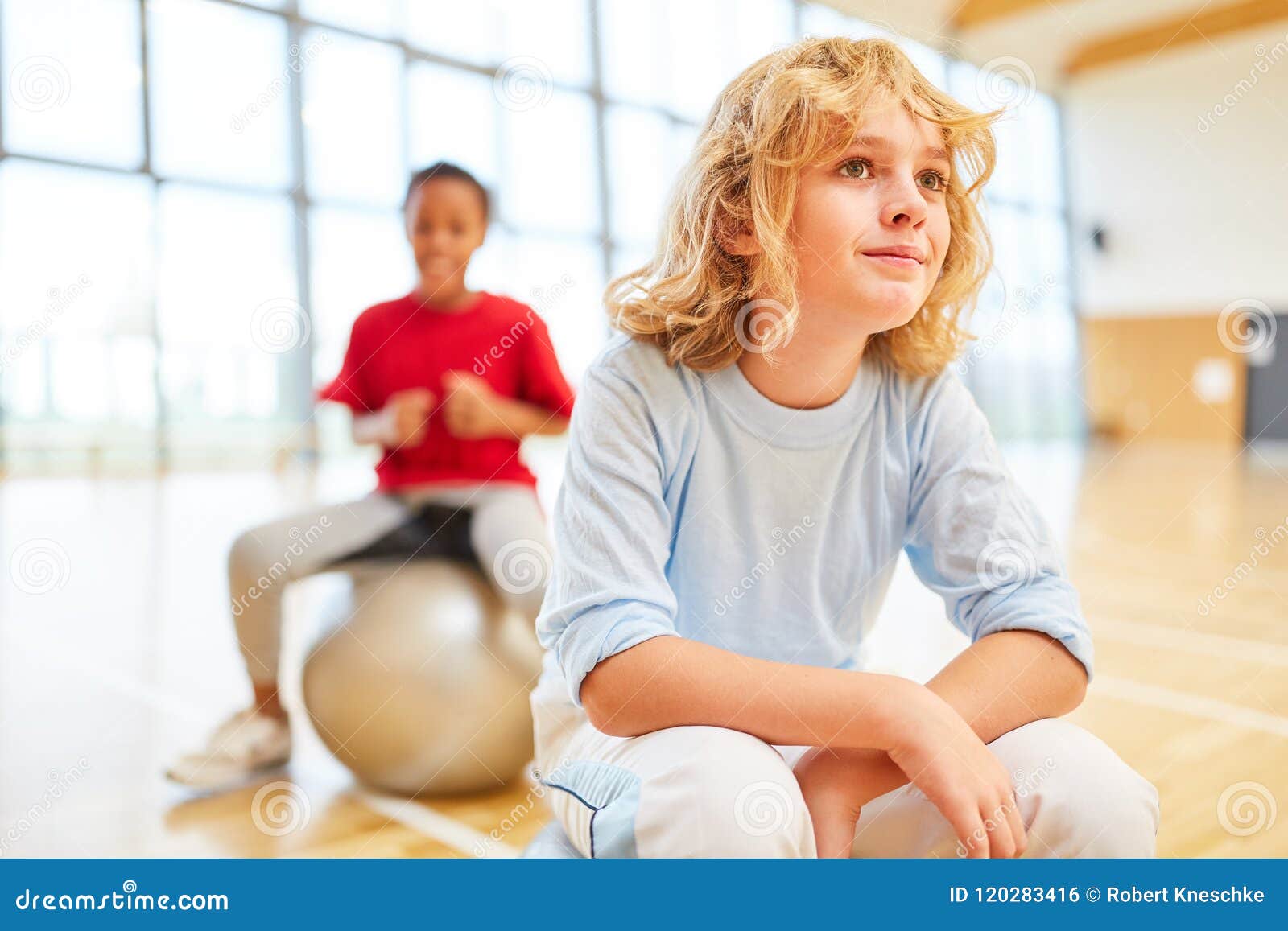 Boy is resting in the gym stock photo. Image of primary - 120283416