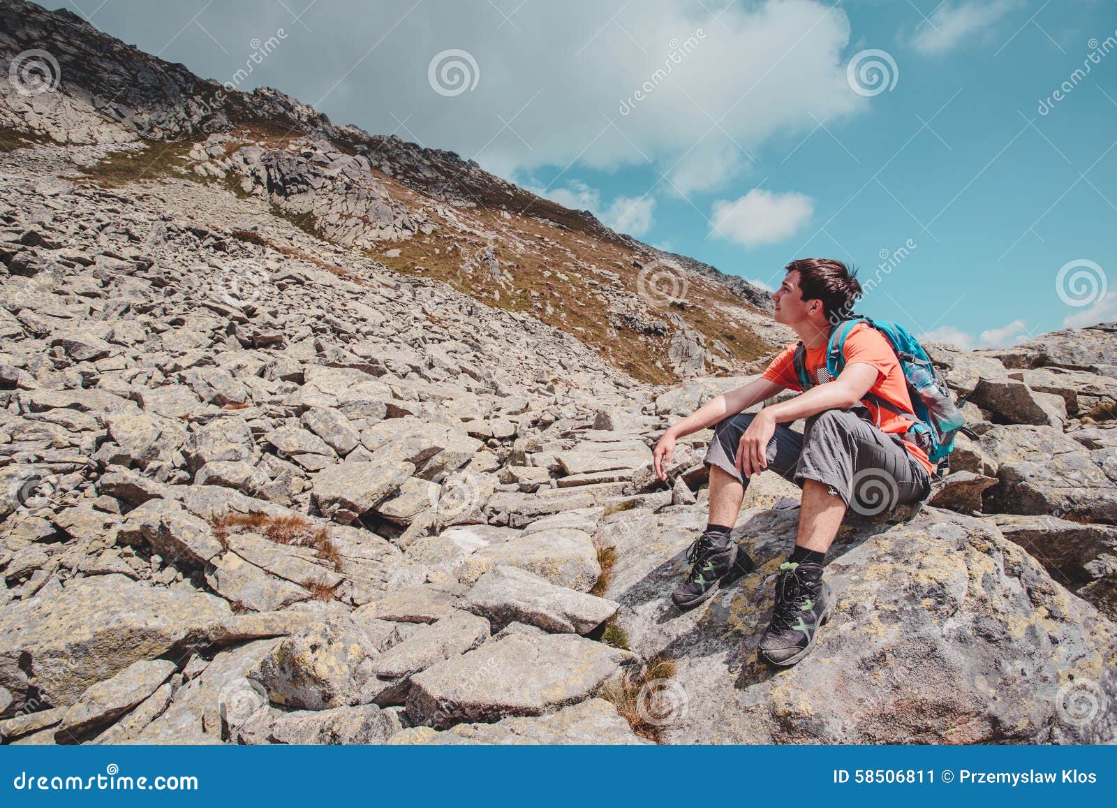 Boy Resting on a Rock in the Mountains Stock Image - Image of freedom ...
