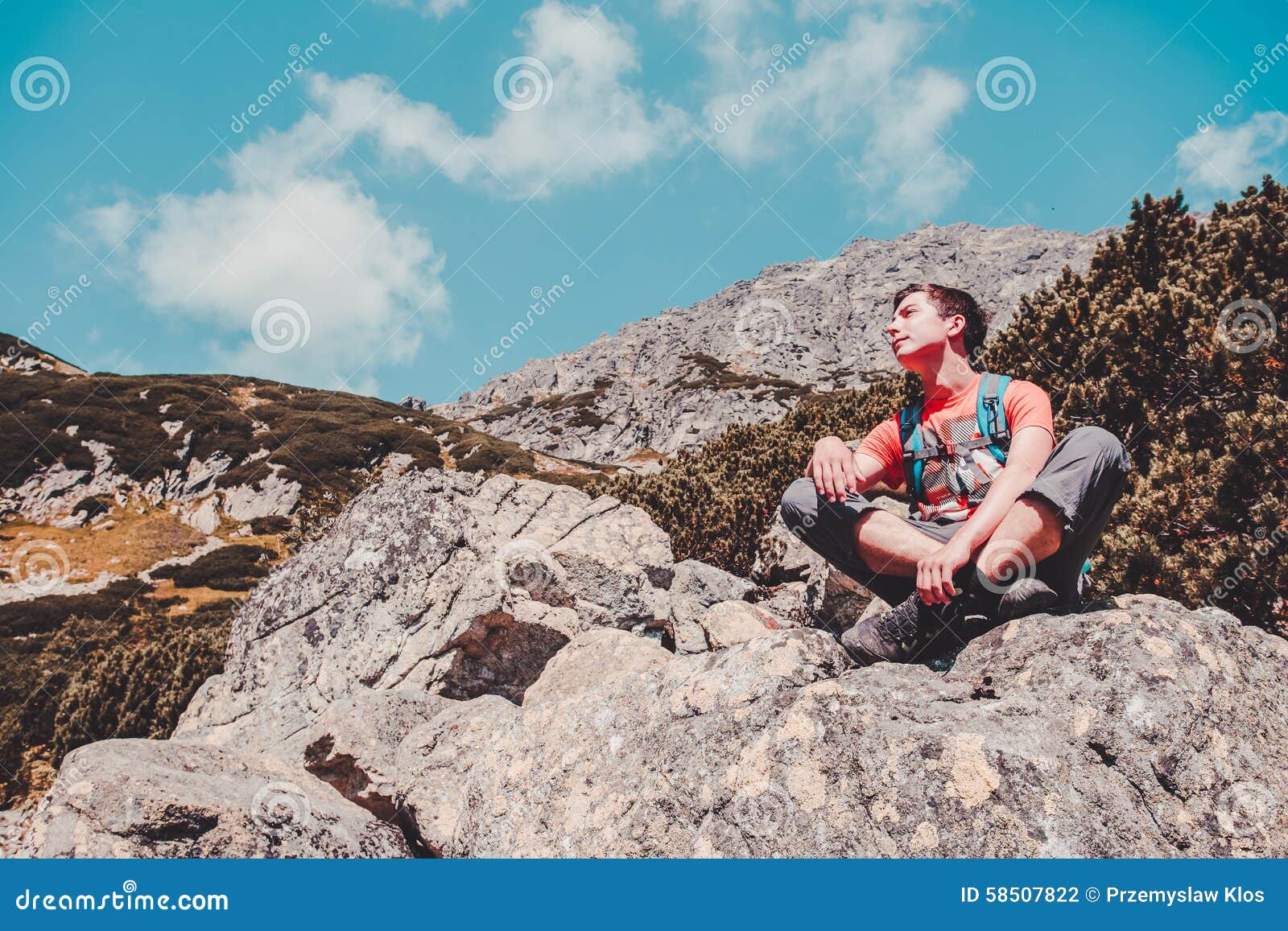 Boy Resting on a Rock in the Mountains Stock Photo - Image of hiker ...