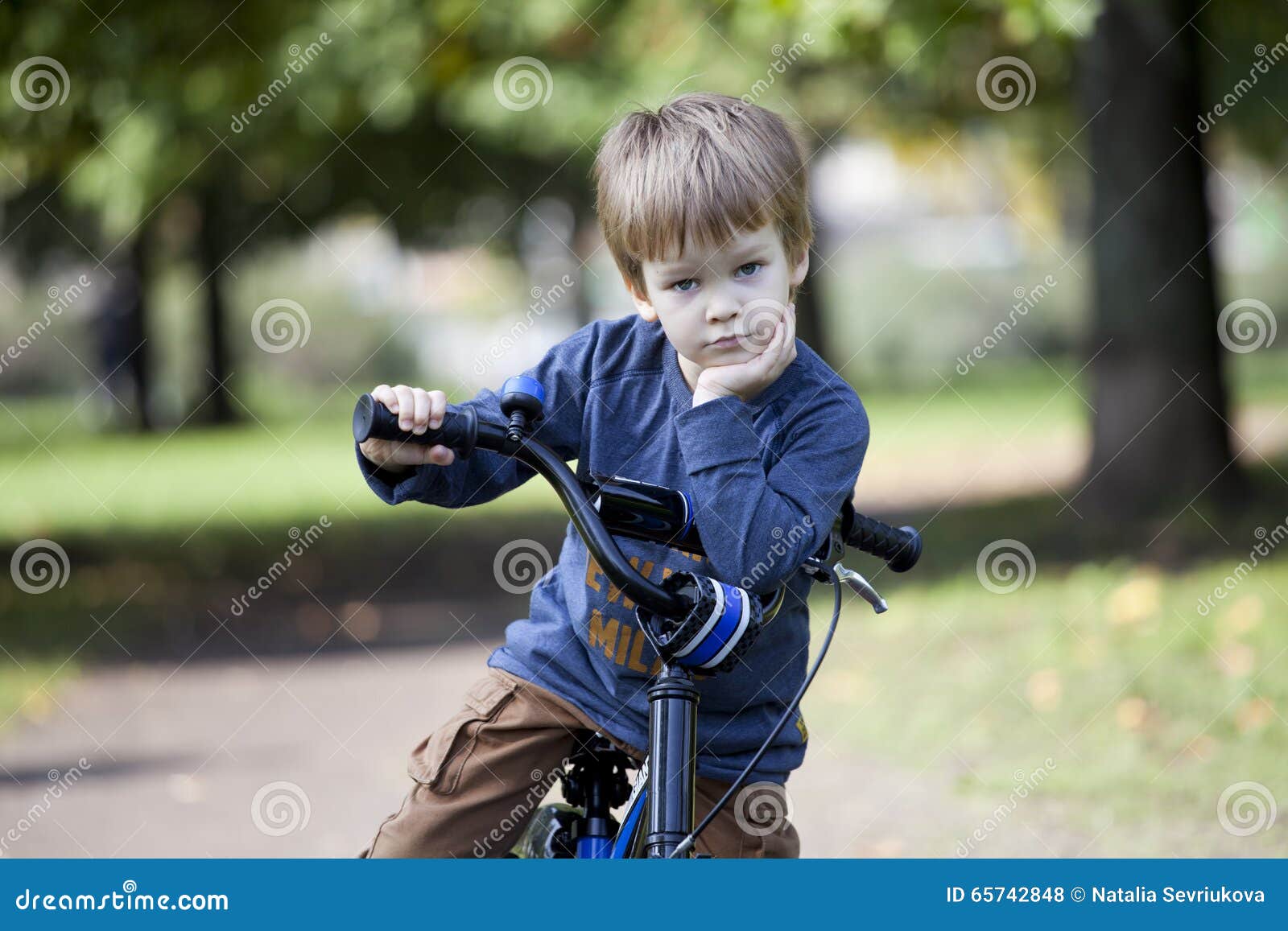 Boy Ride a Bicycle in City Park Stock Photo - Image of healthy, cute ...