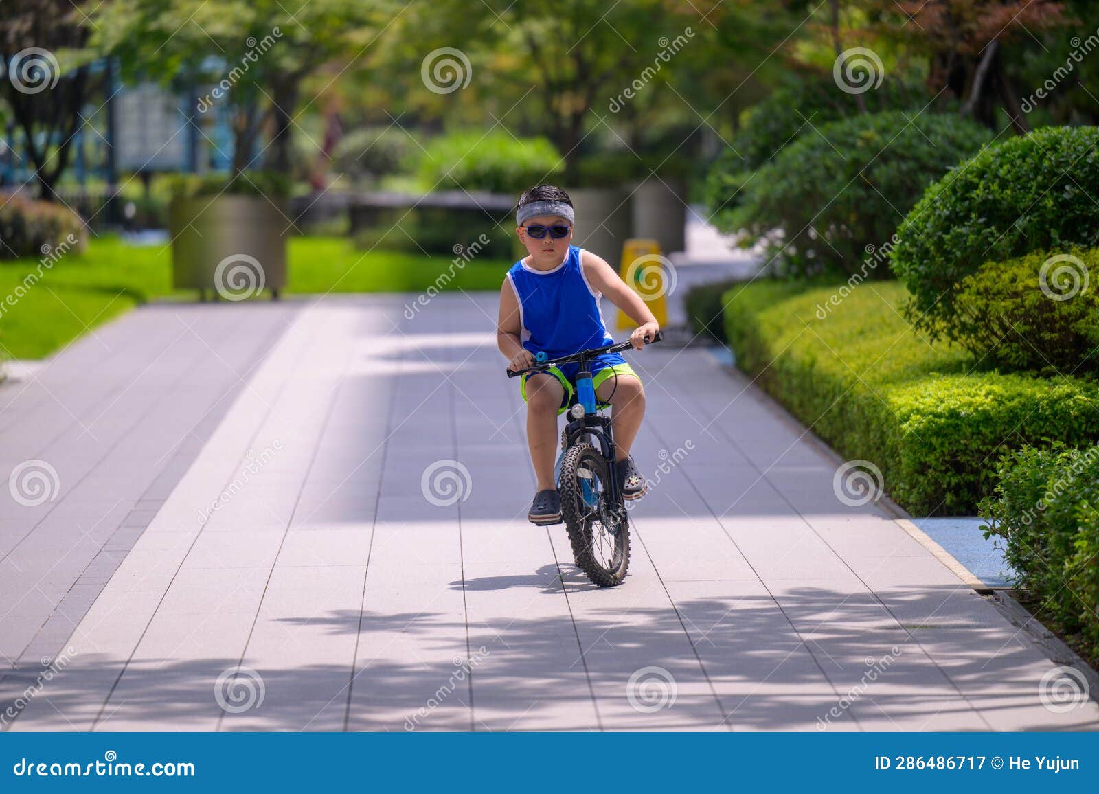 Boy ride on a bicycle stock image. Image of bicycle - 286486717
