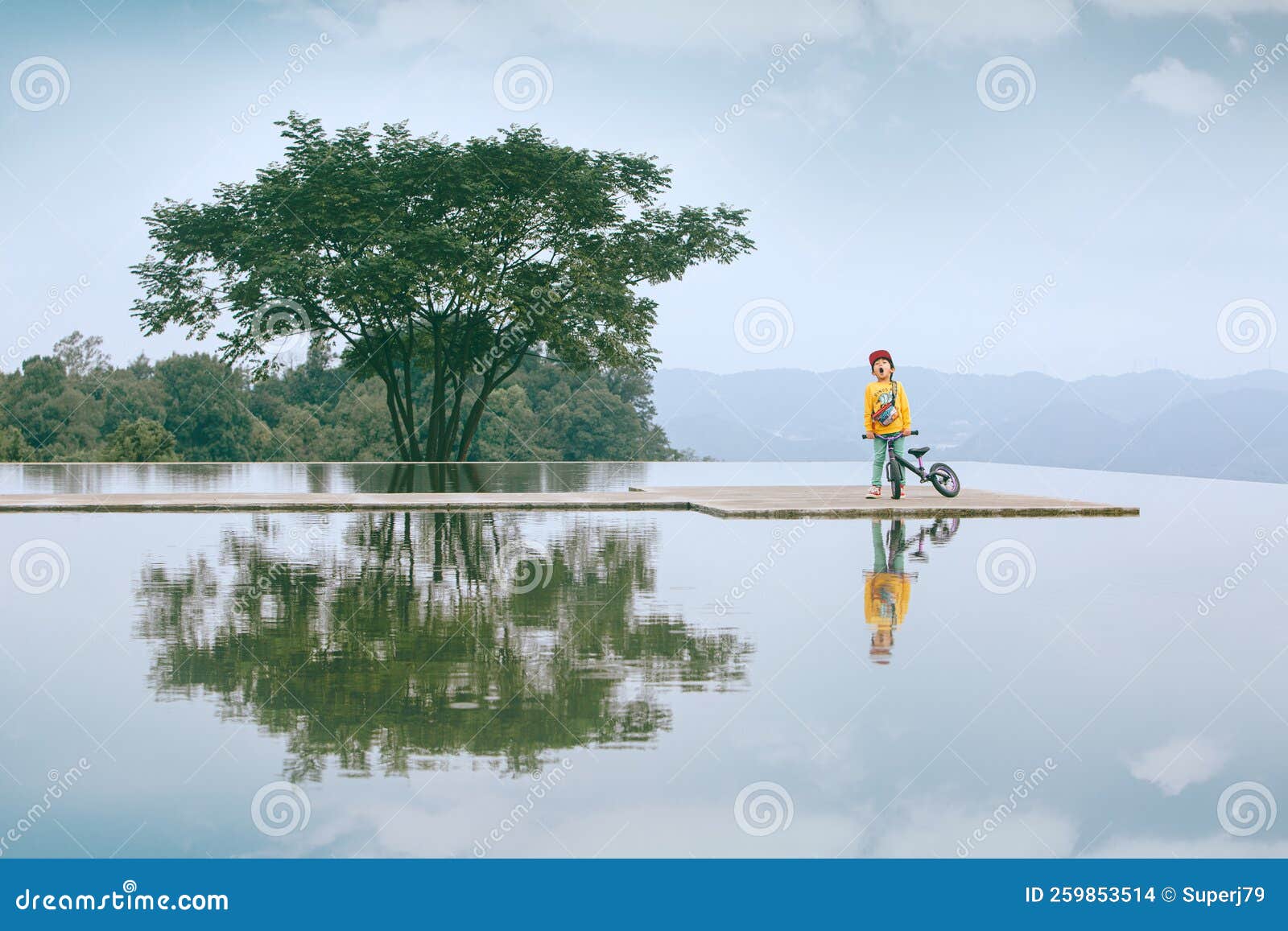 A Boy Rides a Bicycle on a Platform in a Pool Stock Photo - Image of ...