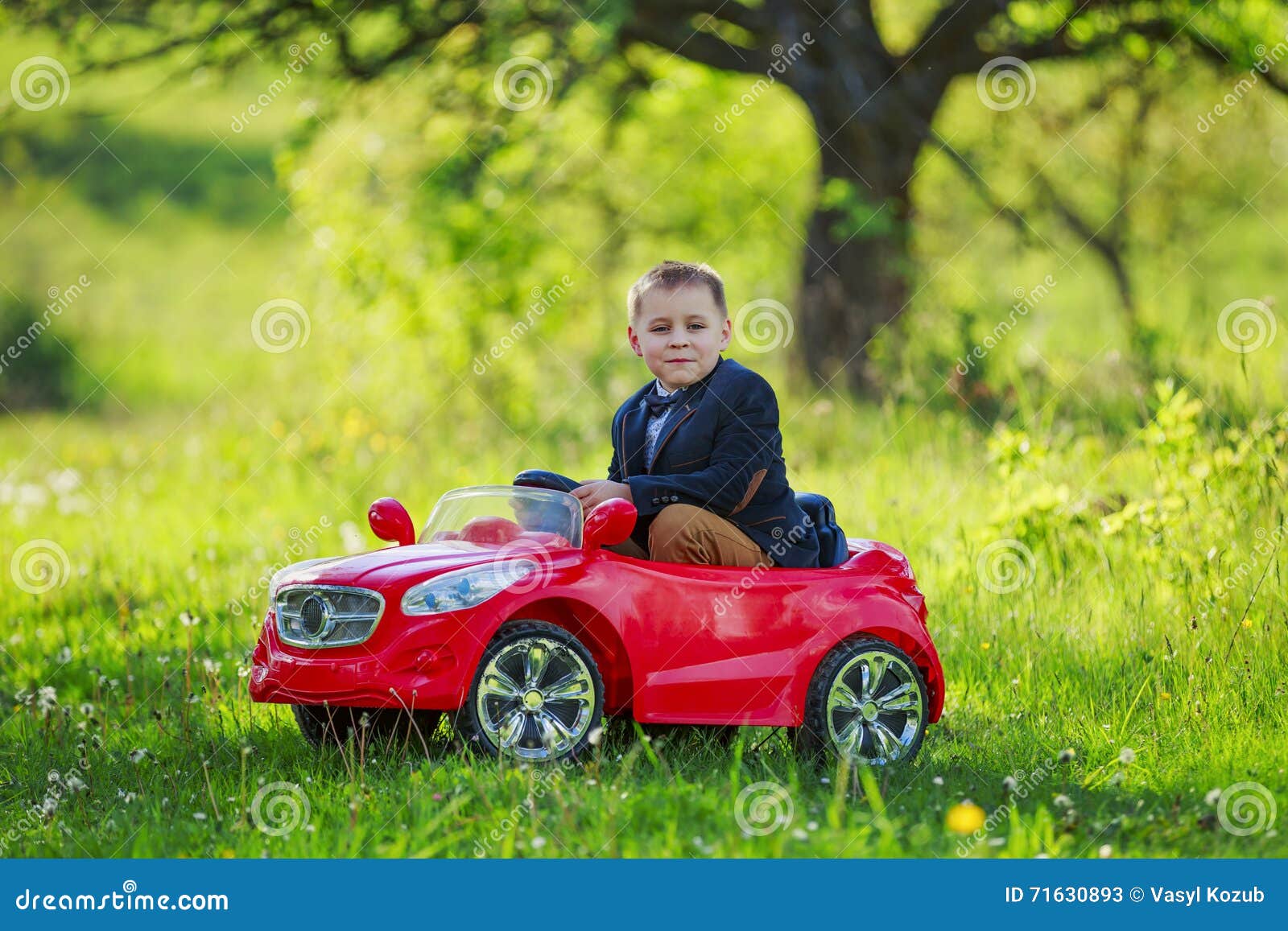 Boy rides a red car stock image. Image of face, concept - 71630893