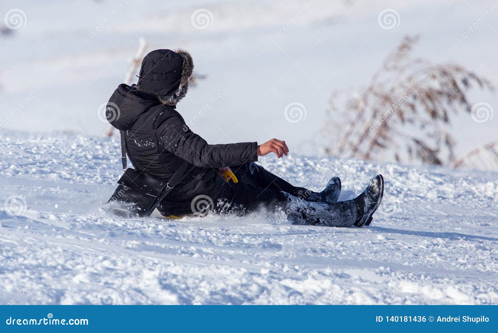 The Boy Rides a Sled from the Mountain in Winter Stock Photo - Image of ...