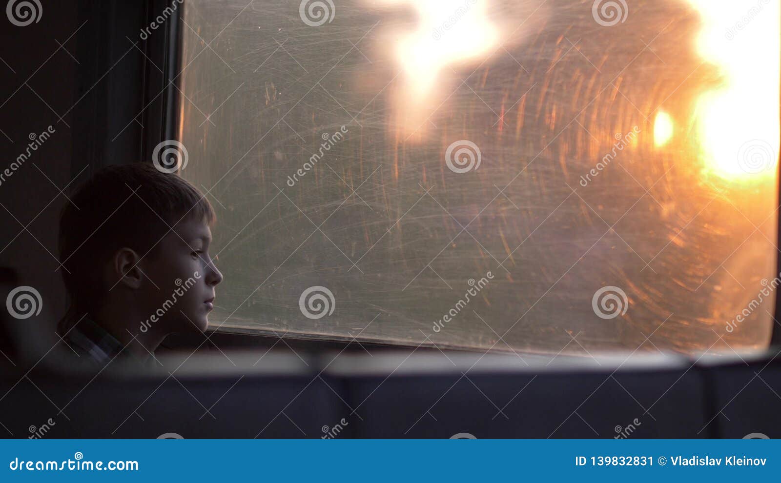 Boy Rides on a Train in the Evening Looks Out the Window Stock Image ...