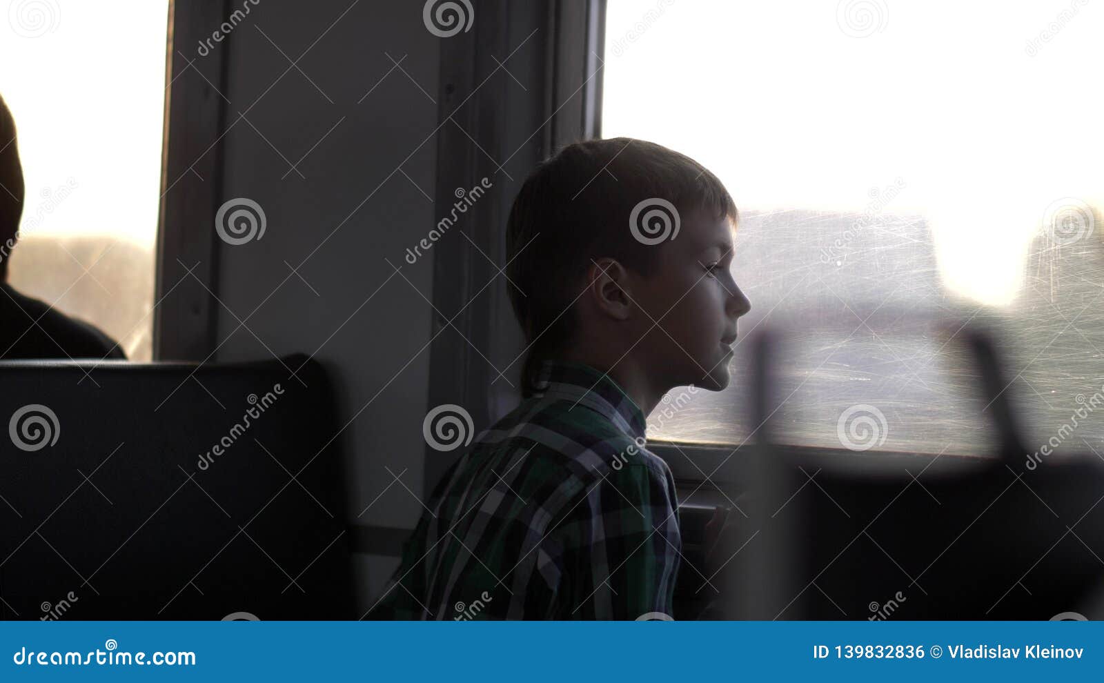Boy Rides on a Train in the Evening Looks Out the Window Stock Photo ...