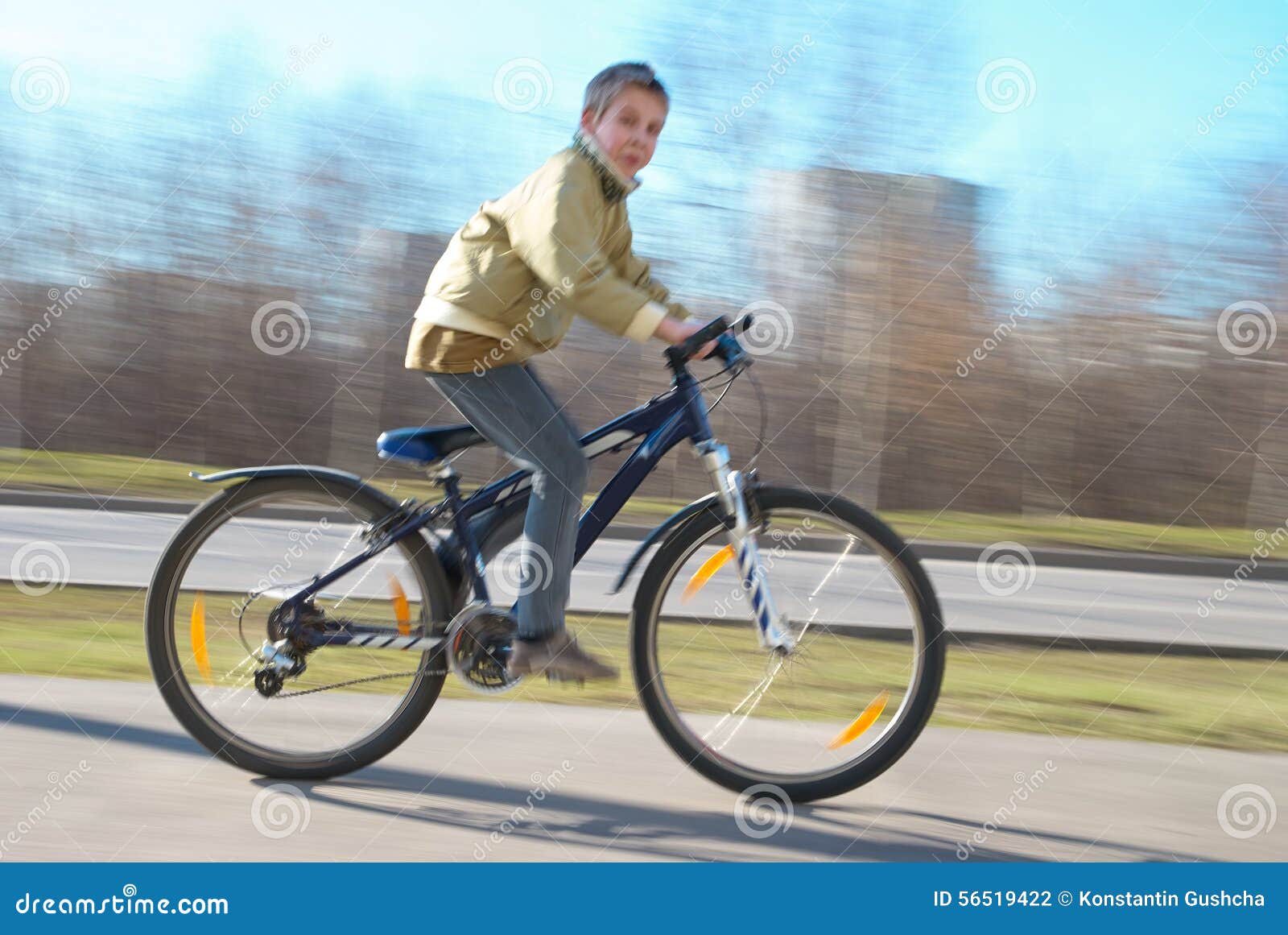 Boy rides very fast stock photo. Image of protection - 56519422