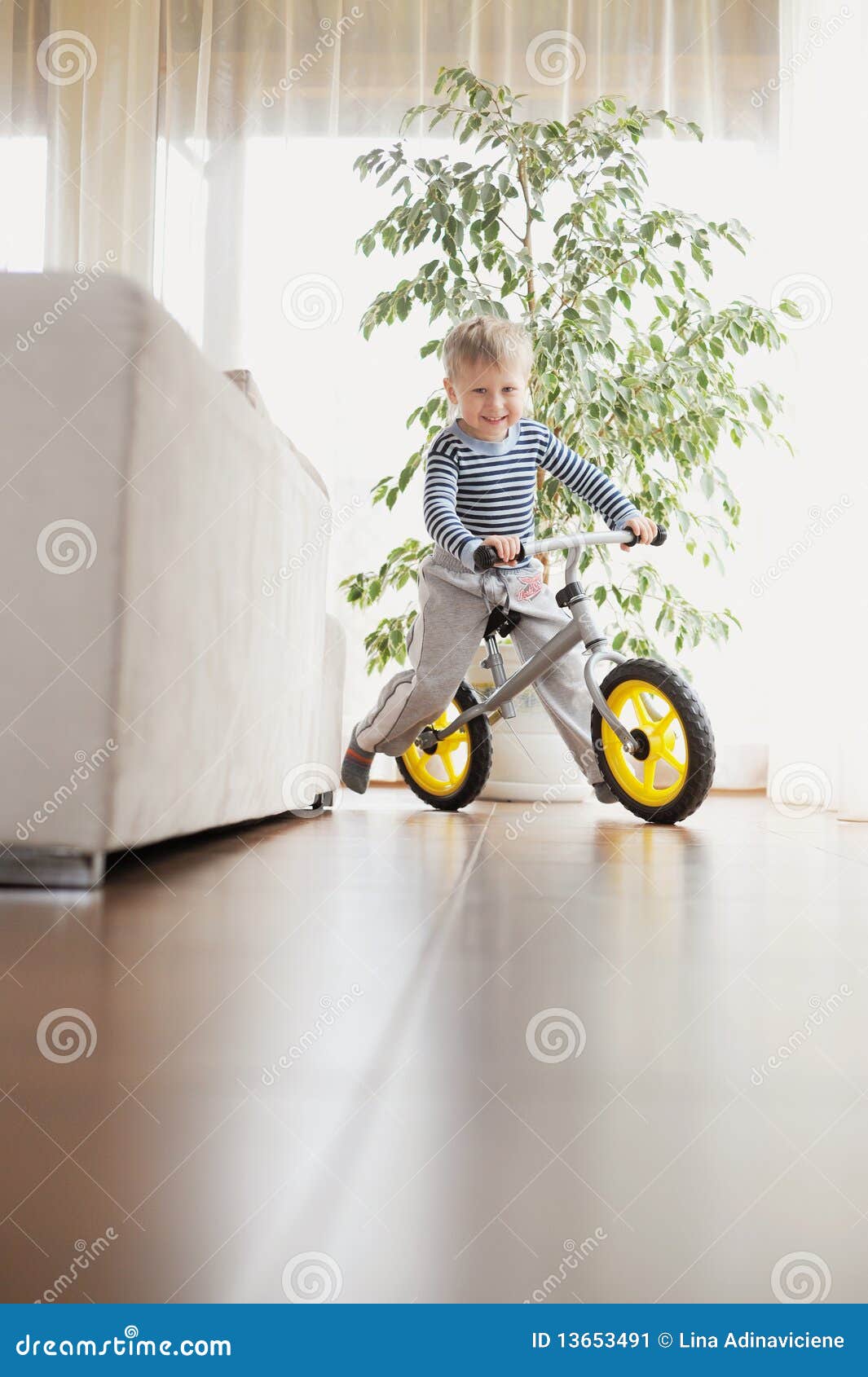 Boy riding bike indoors stock image. Image of cycle, fall - 13653491