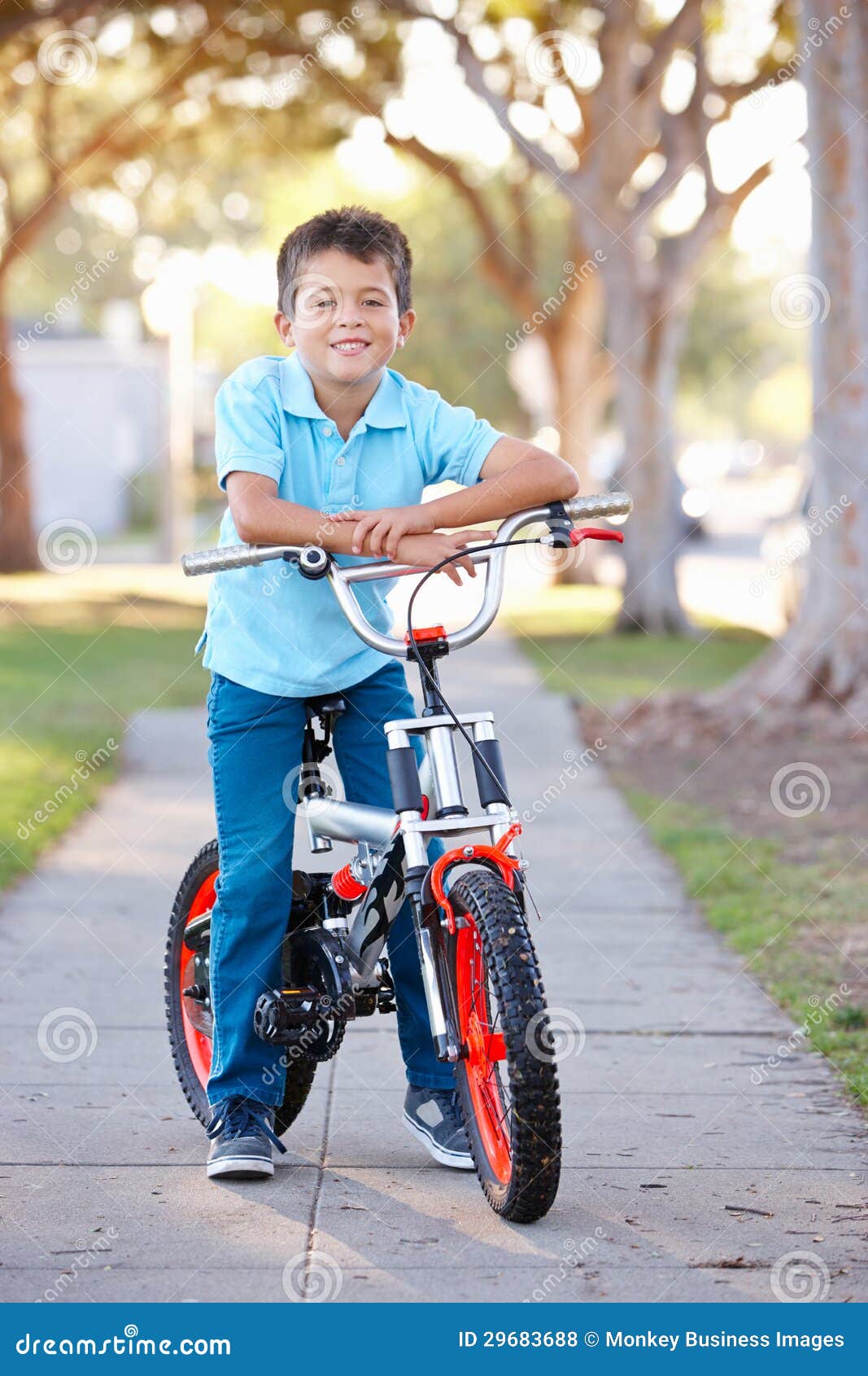Boy Riding Bike on Path stock photo. Image of portrait - 29683688