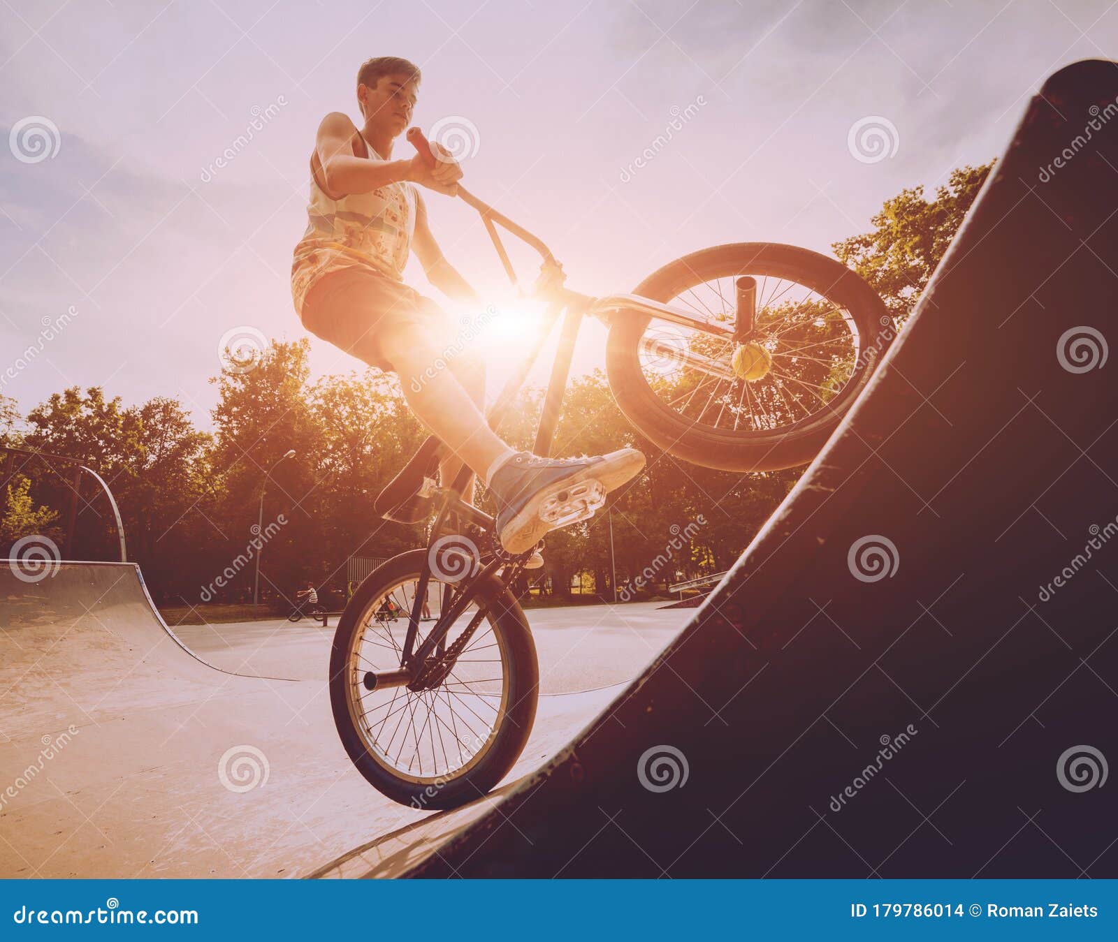 Boy Riding a Bmx in a Park. Stock Photo - Image of jumping, pursuit ...