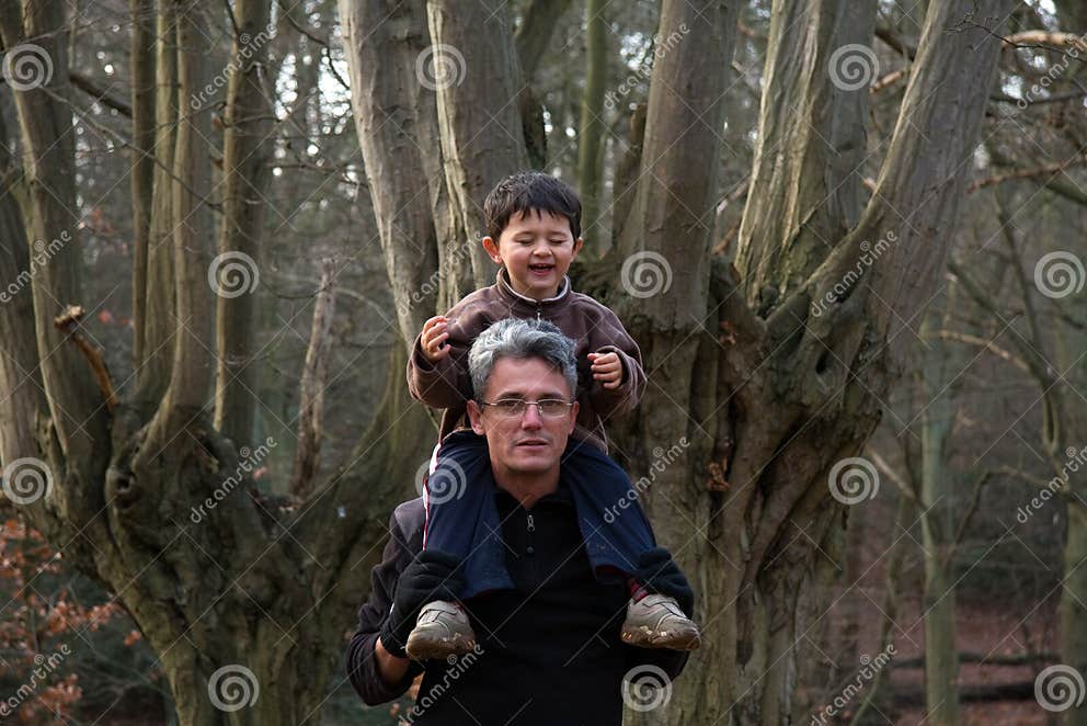 Boy Riding on Dad S Shoulders Stock Image - Image of childhood, walking ...