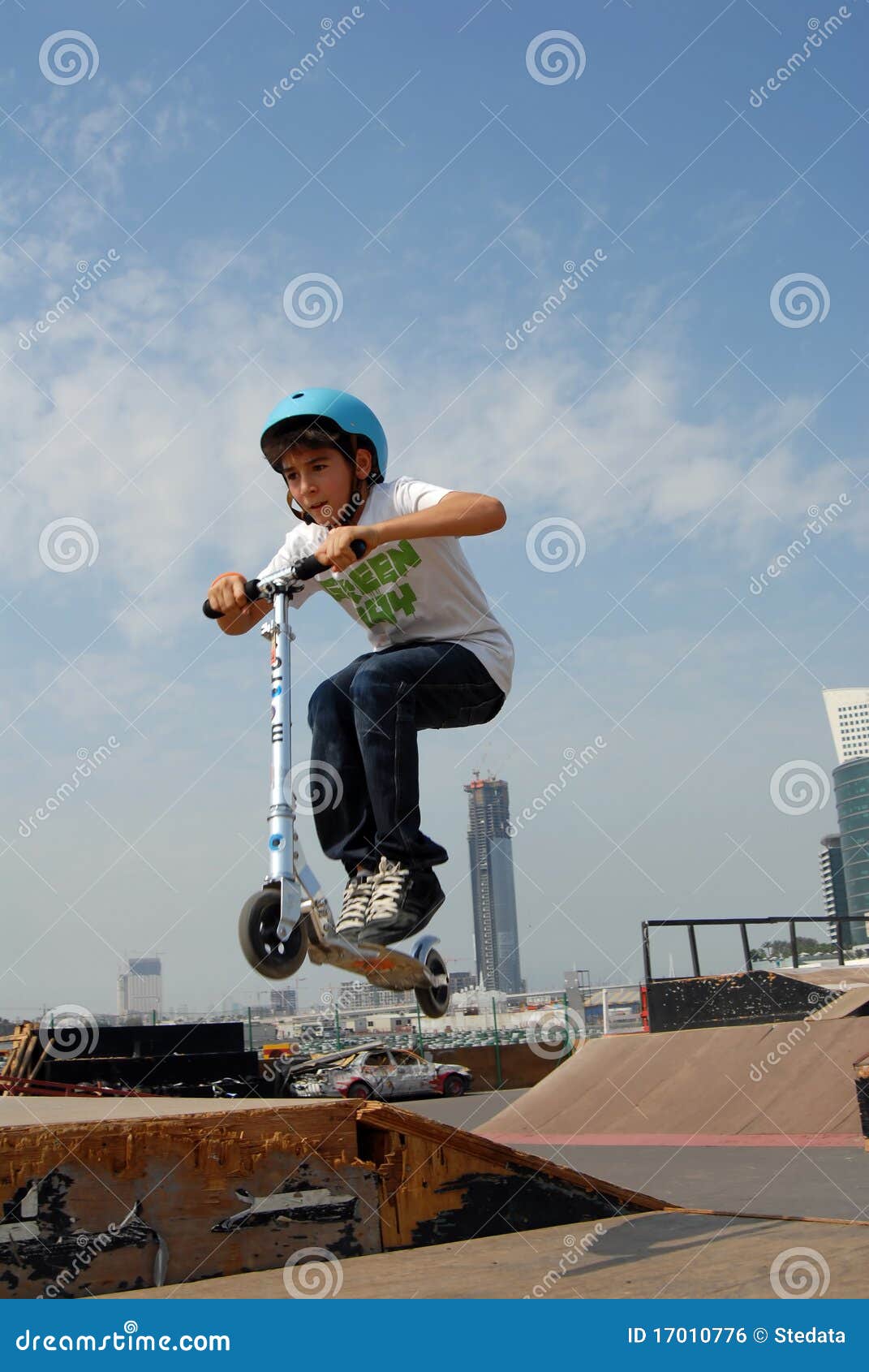 Boy riding his Scooter stock photo. Image of park, skateboarding - 17010776