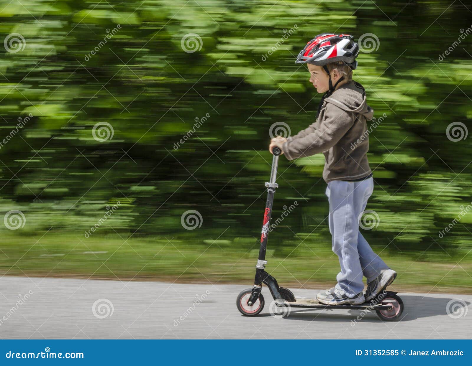 Boy riding his scooter stock image. Image of healthy - 31352585