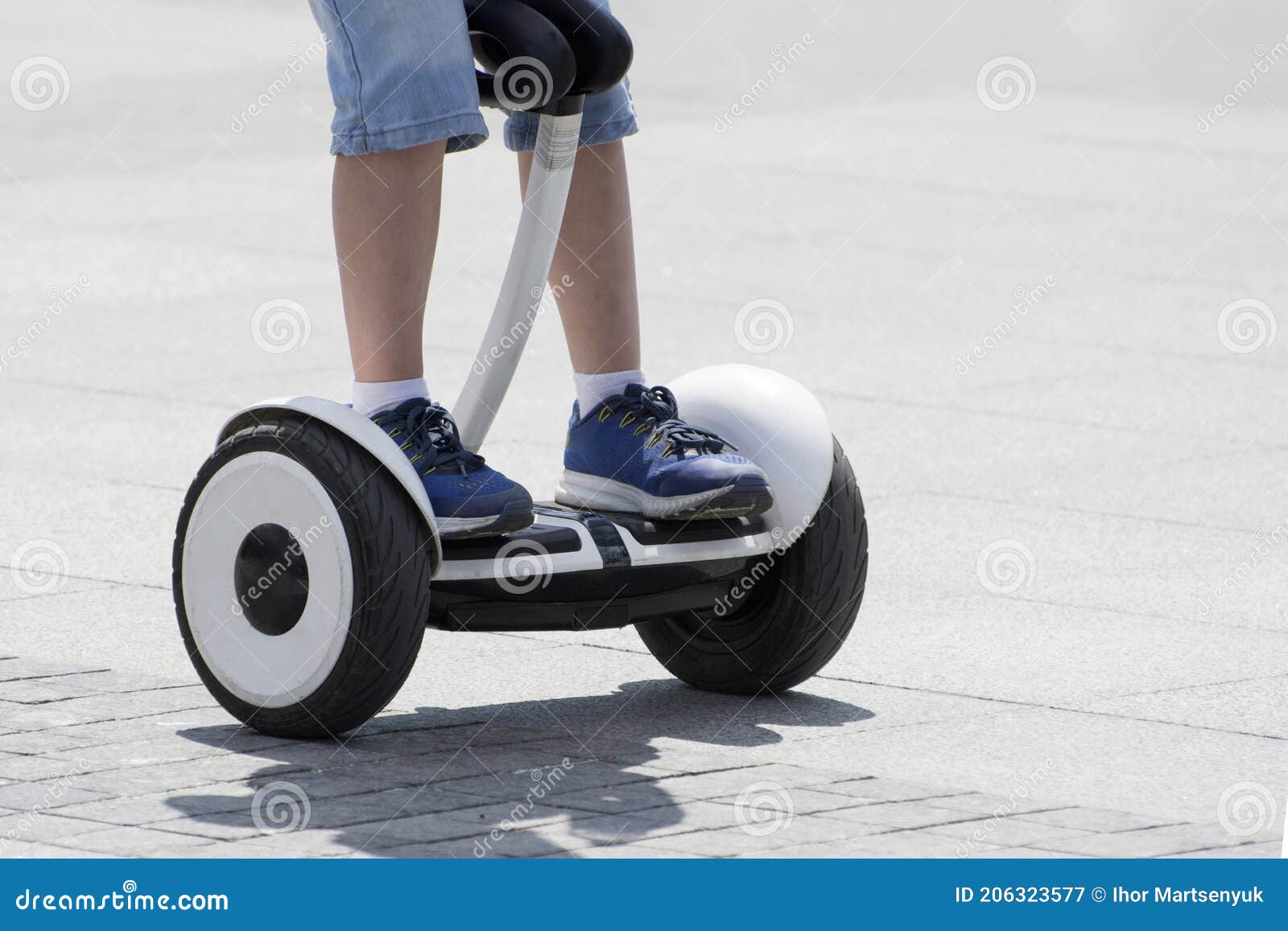 Boy Riding on the Hoverboard in the Park. a New Ride Technologies Stock ...