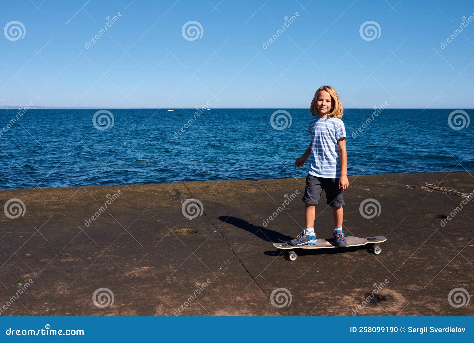 Boy Riding a Longboard on a Pier at Sunny Day Stock Photo - Image of ...
