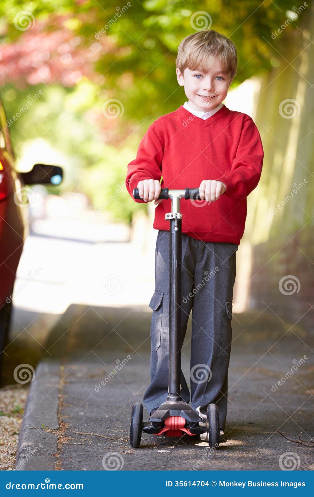 Boy Riding Scooter on His Way To School Stock Photo - Image of looking ...